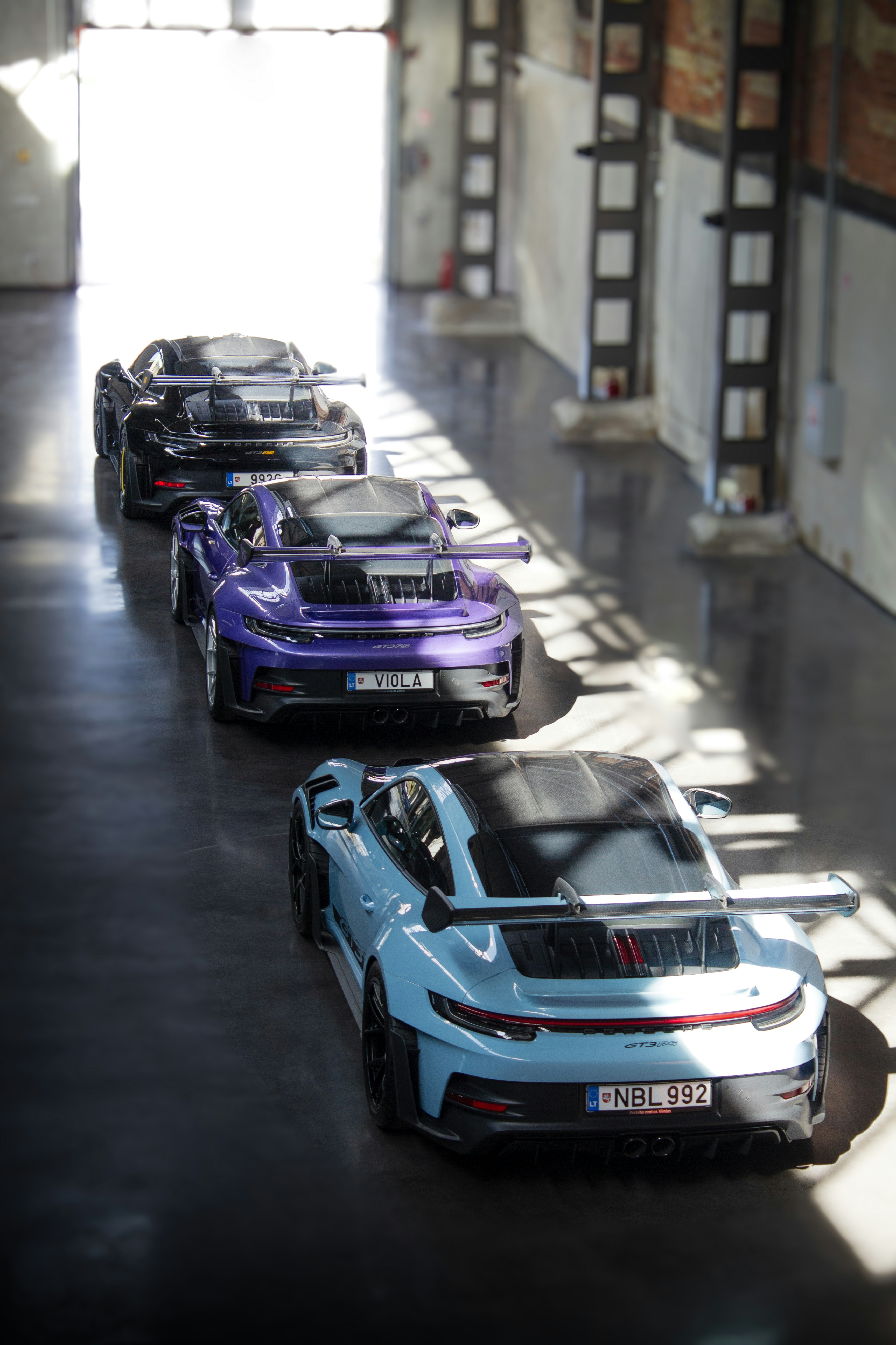 Line of Dream Cars: A Neon-Fueled Parade in Soft Warehouse Light