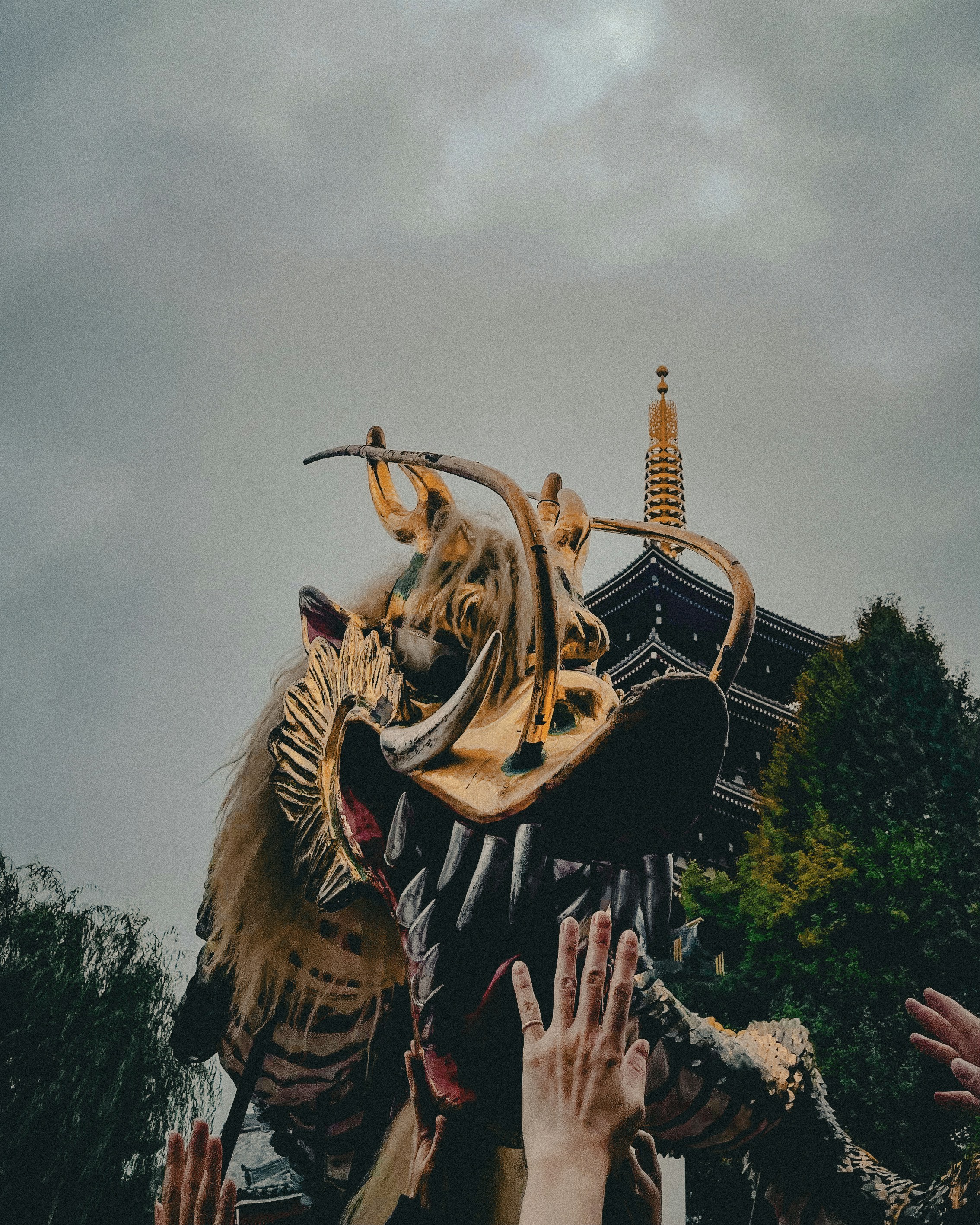 Dragon Mask, Temple Spire, and Reaching Hands