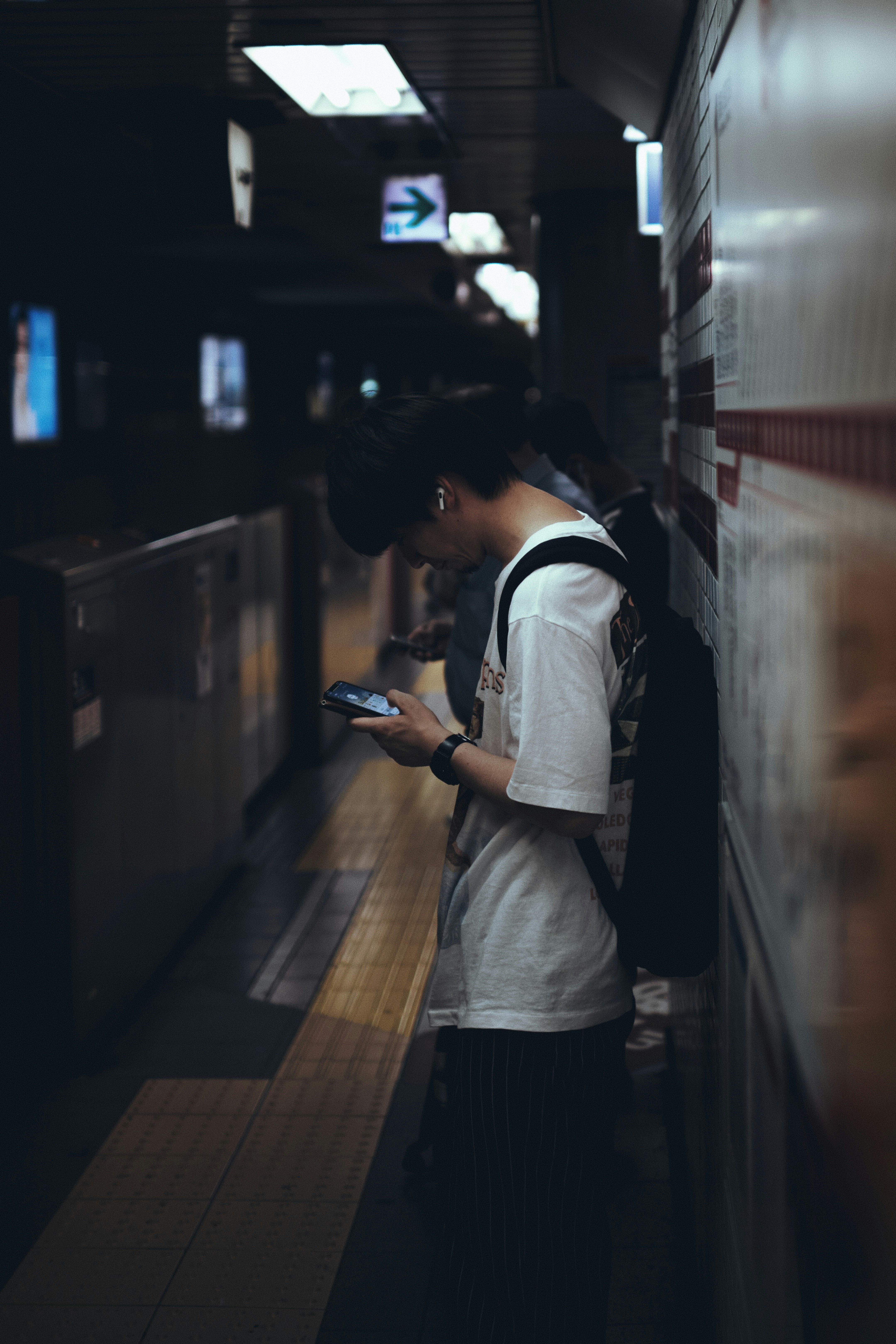 Quiet Focus in a Neon Corridor