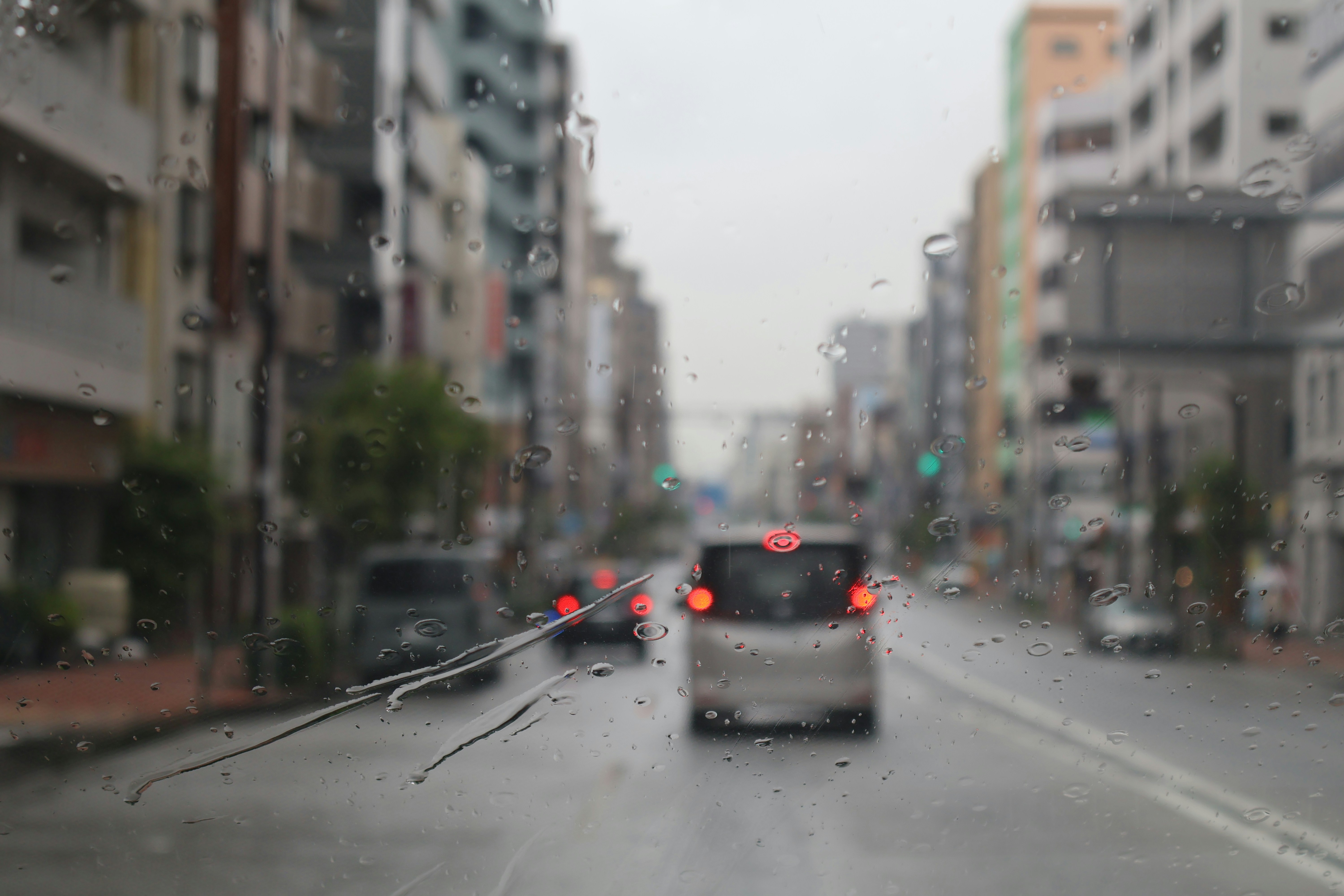 Blurred Street: Rainy Corridor of City Lights