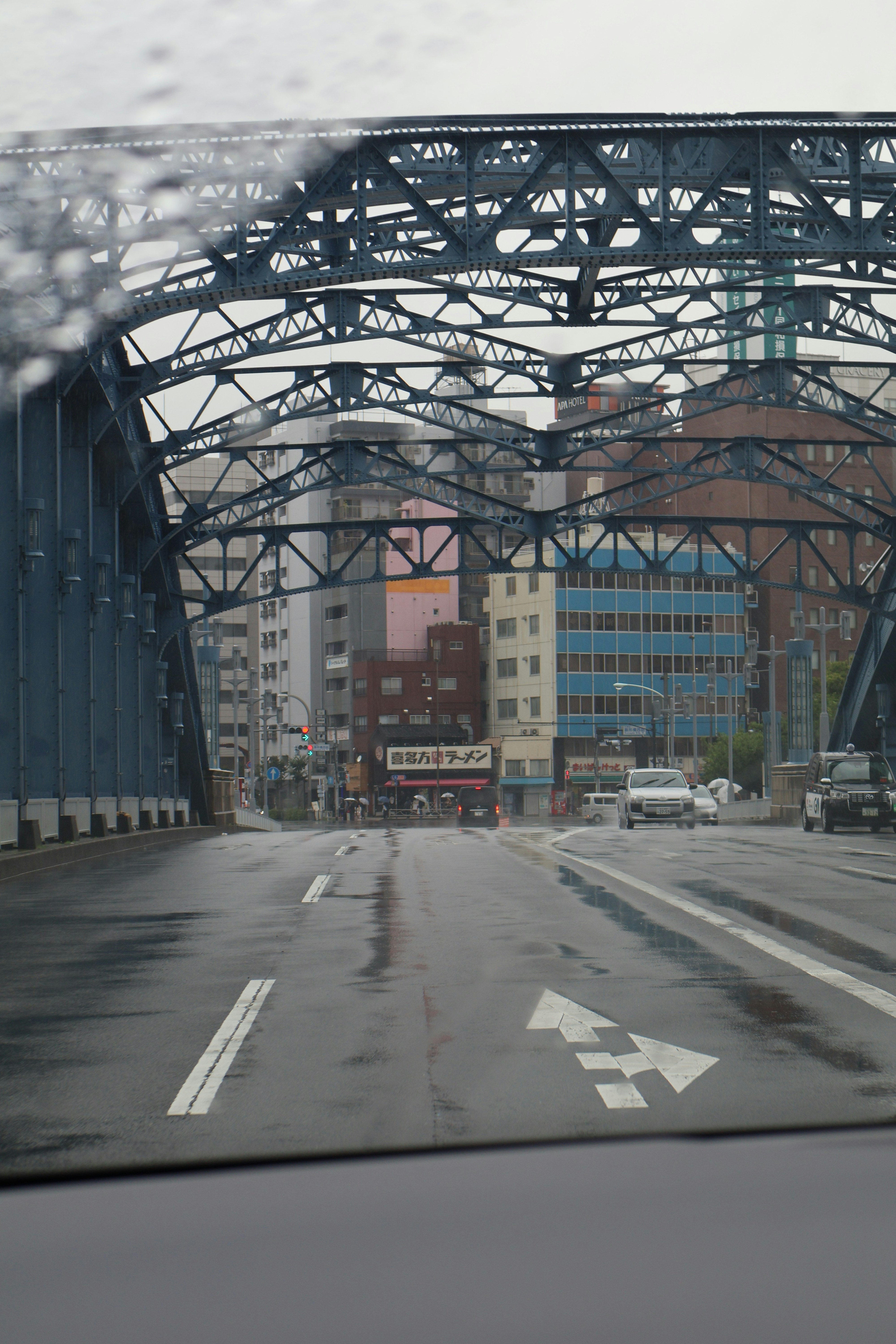 City in Transit: Rainy Day Under the Iron Arches