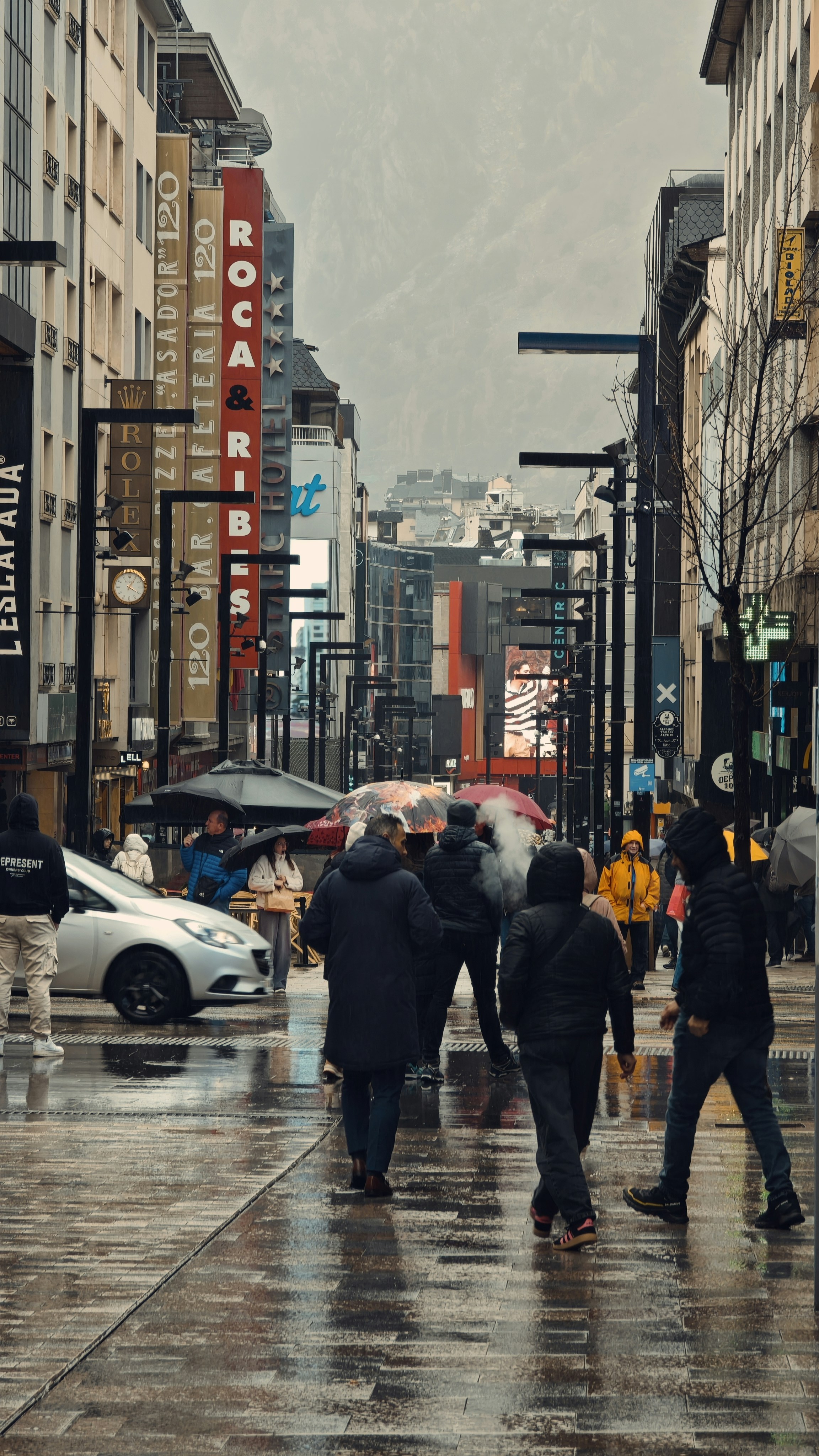 Rainy Times Square: Pedestrians Navigate a Wet City Boulevard