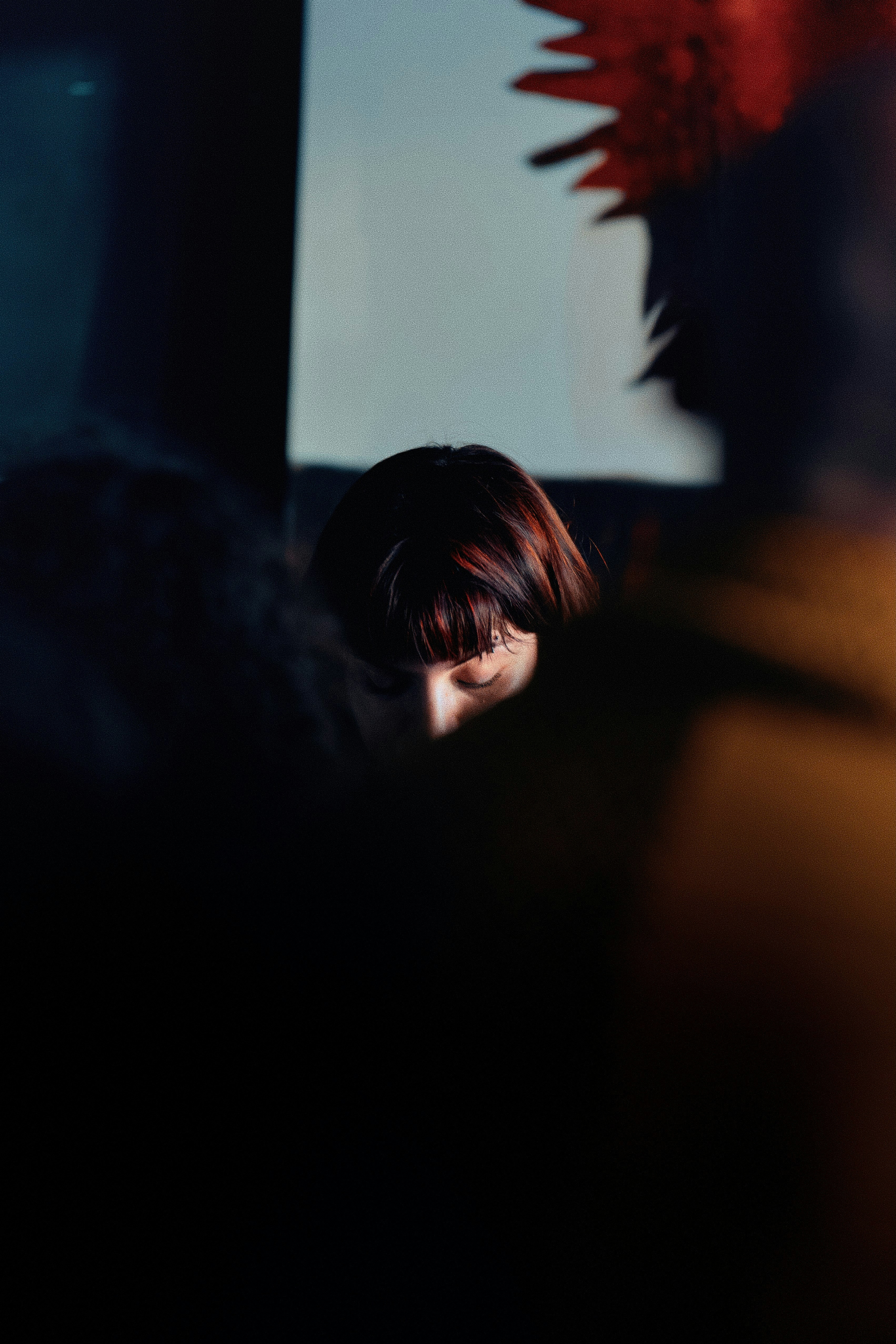 Veiled Headlines: A Quiet Moment in the Dim Club