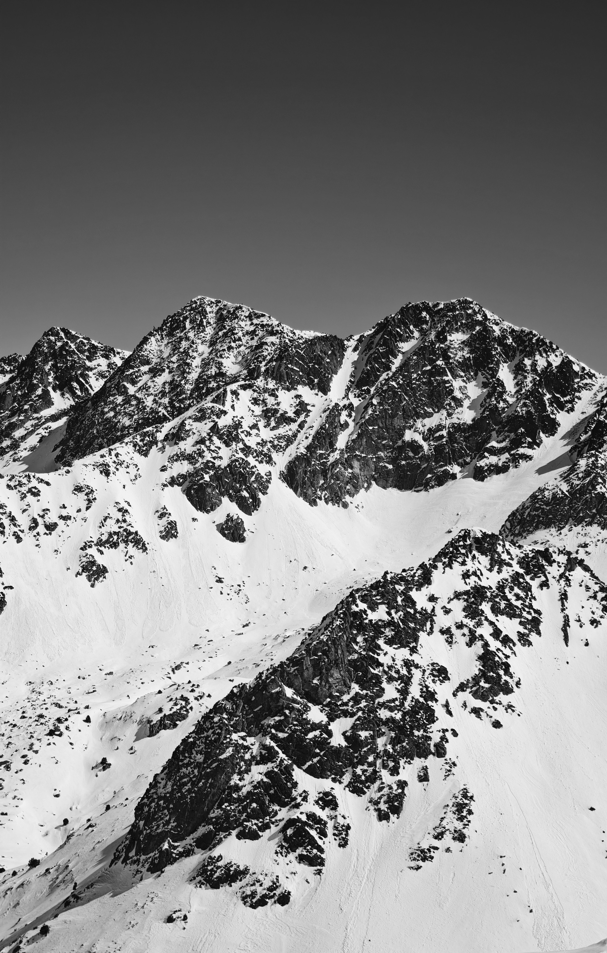 Monolithic Silence: Snow-Crowned Peaks under Gradient Sky