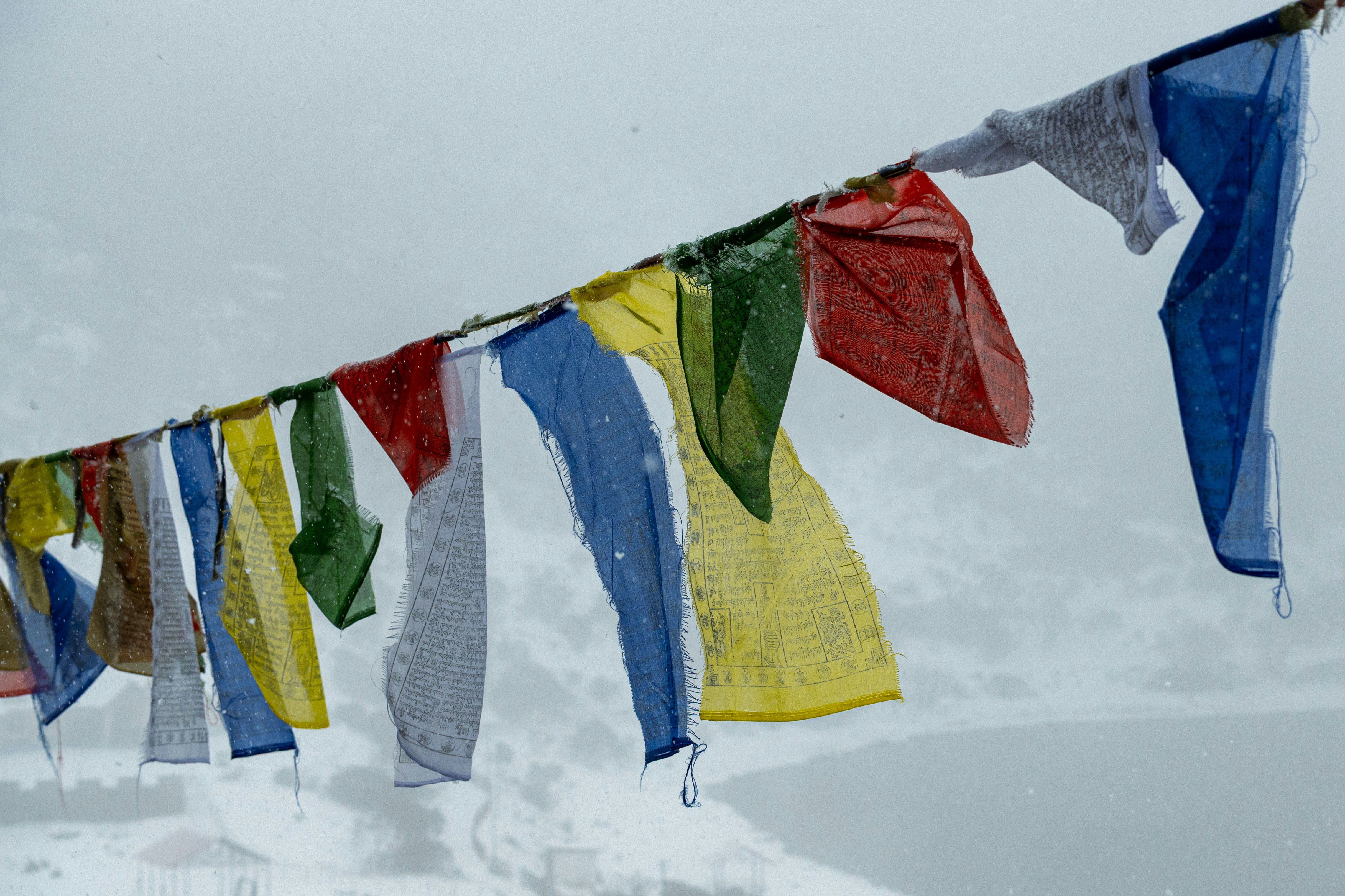 Flags of Color Against Snow: Prayer Ribbons in a Quiet Winter Valley