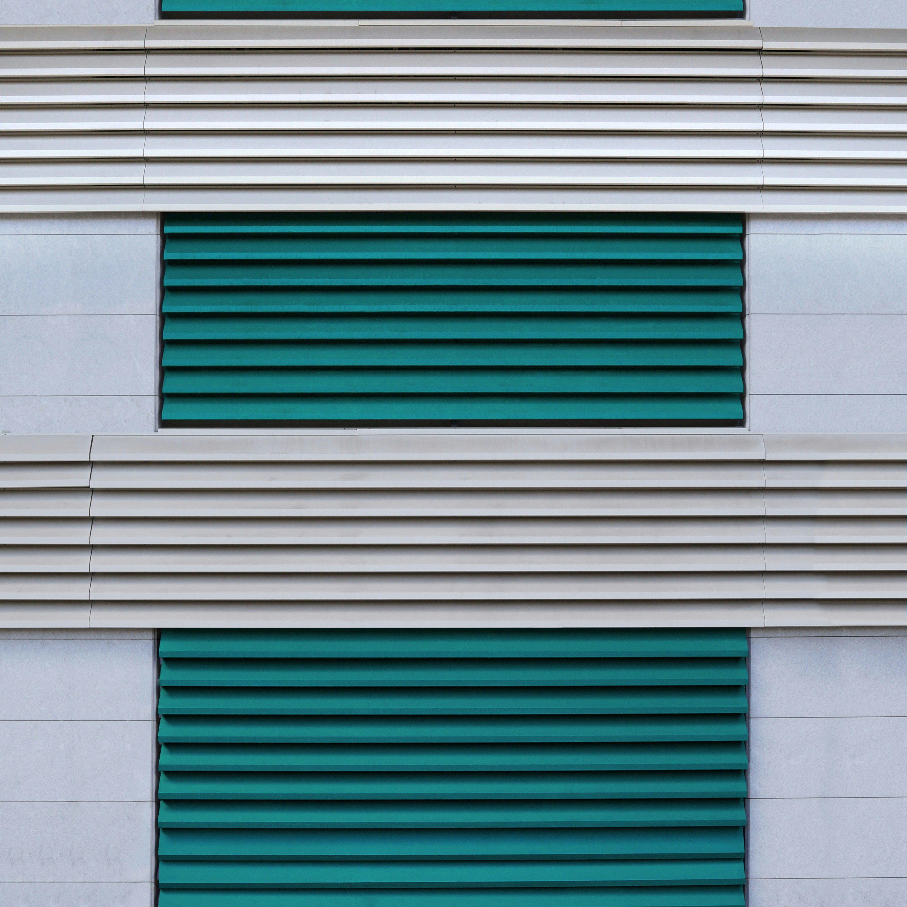 Teal Slats in Cross-Hatch Facade Rhythm
