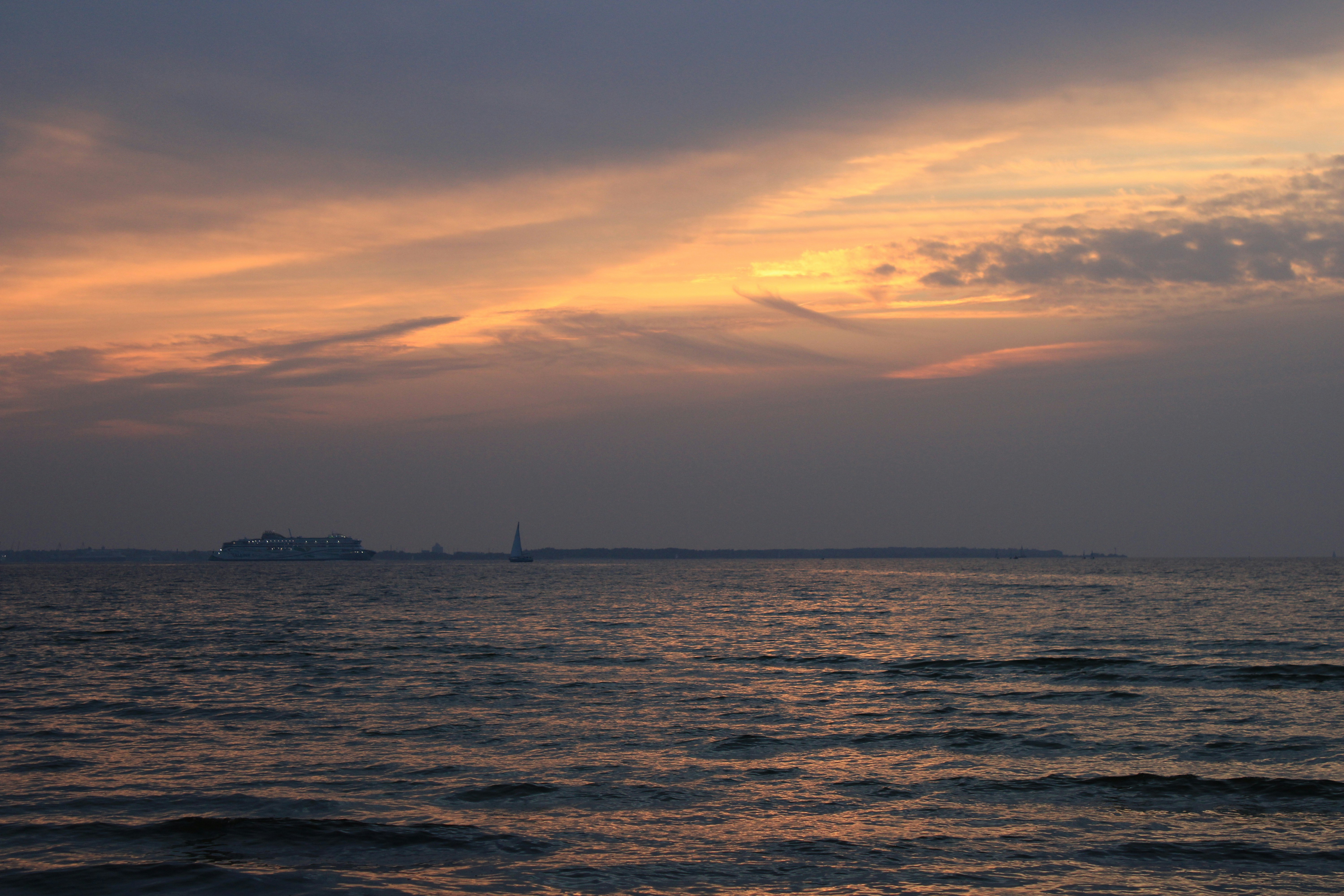 Horizon Fire: Sunset Over Calm Seas