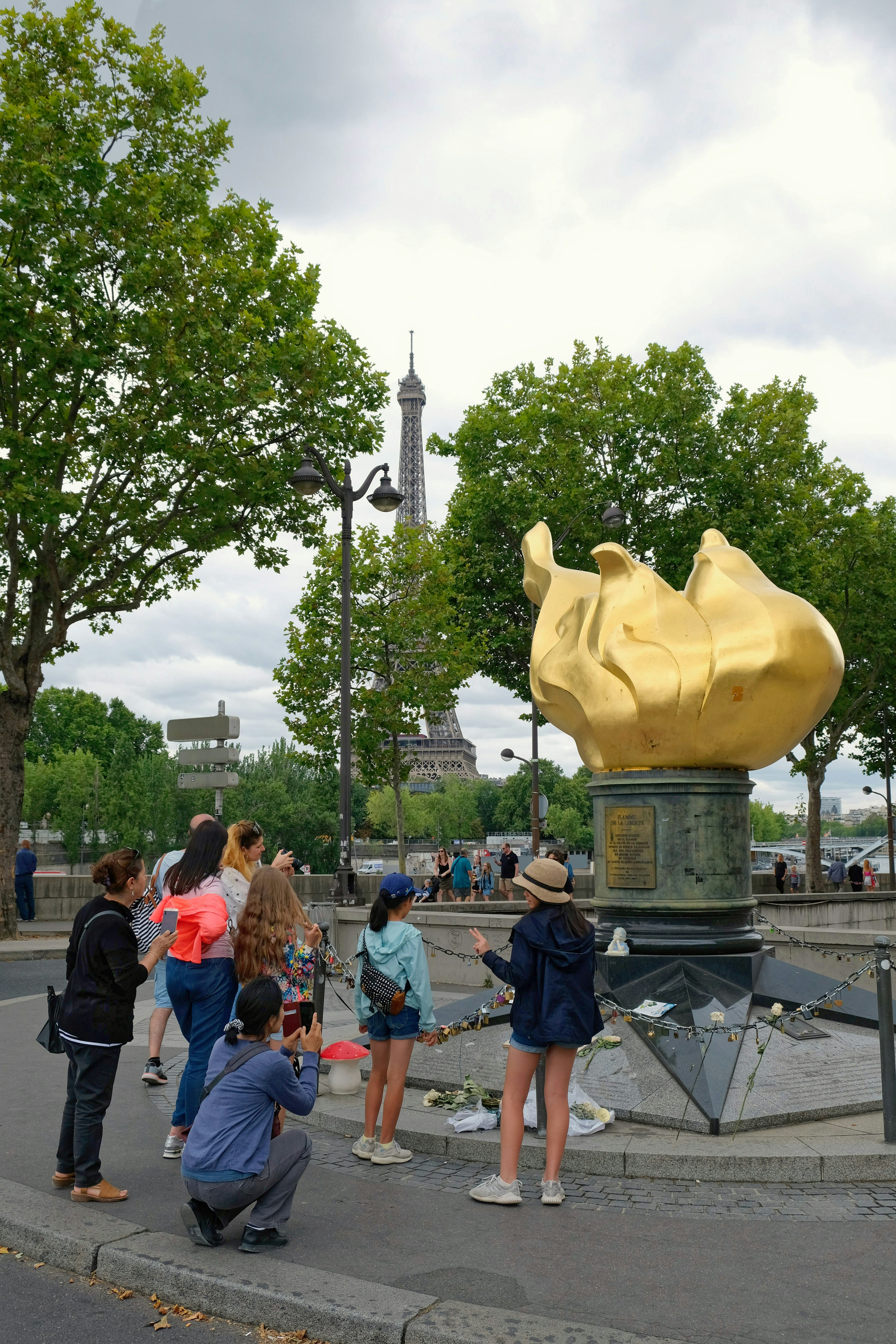 Golden Flame on the Seine: Portrait of Fans at the Trocadéro