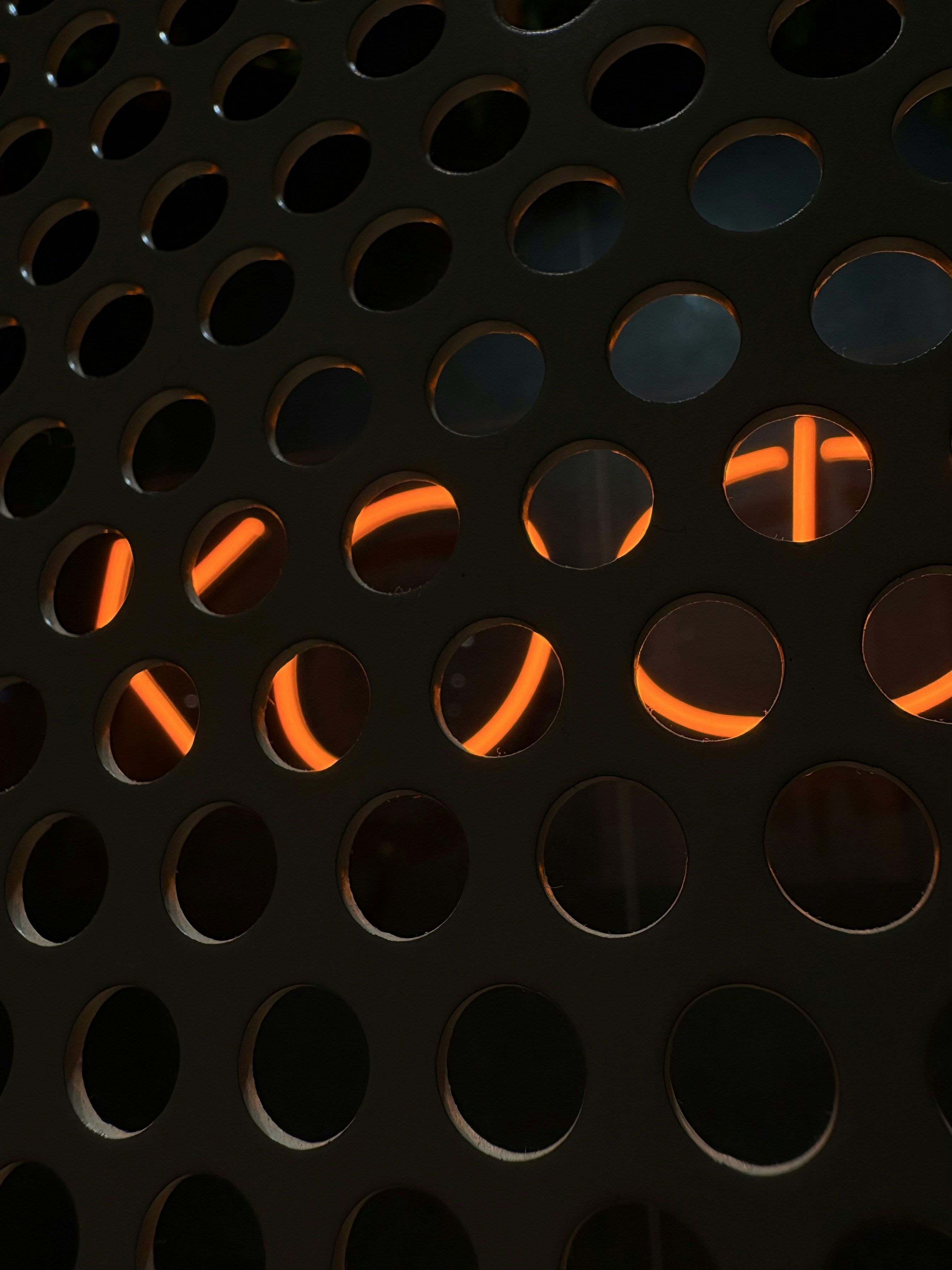 Copper glow through industrial perforations