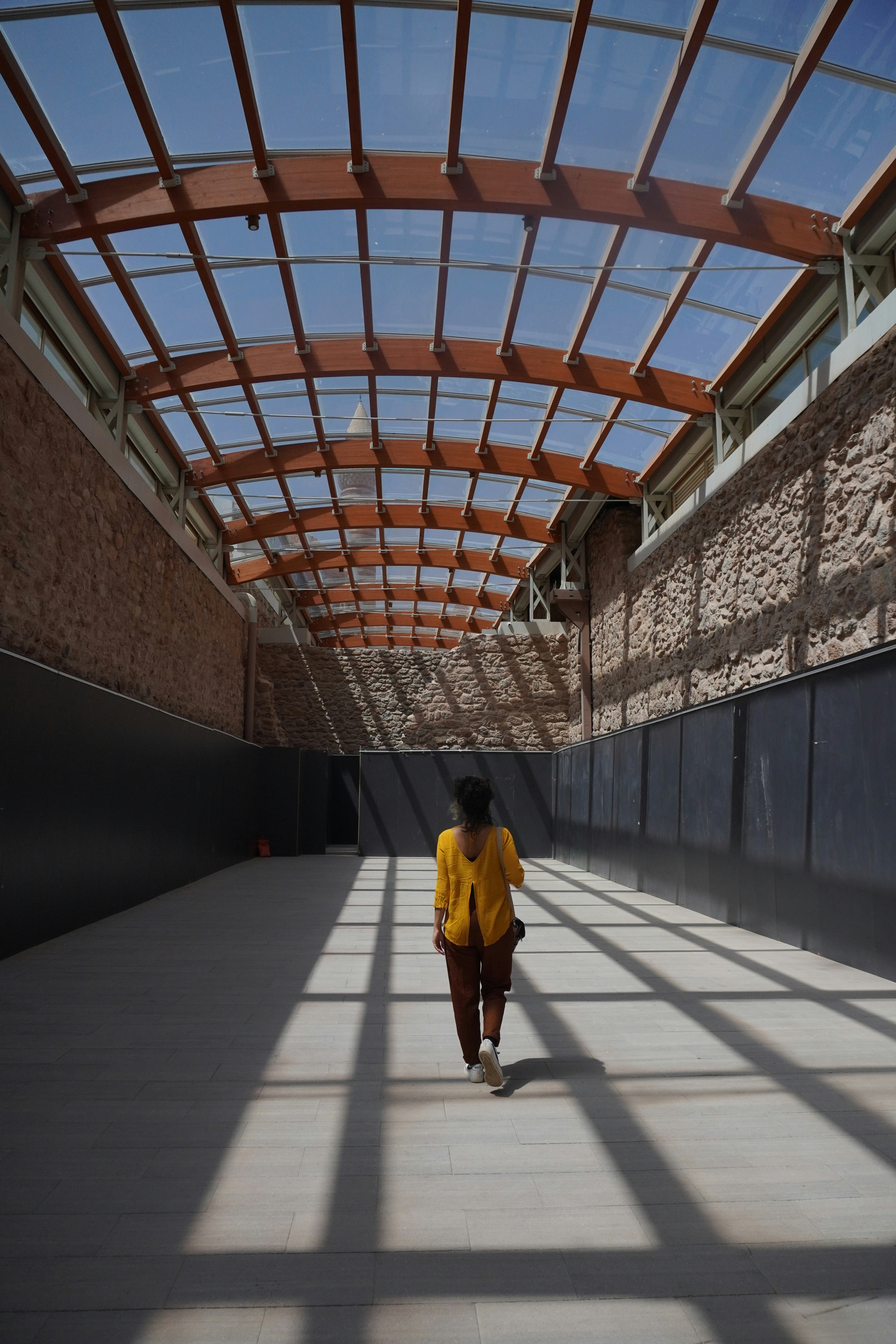 Footpath to the Sunlit Arch: A Quiet Walk Through Glass and Stone
