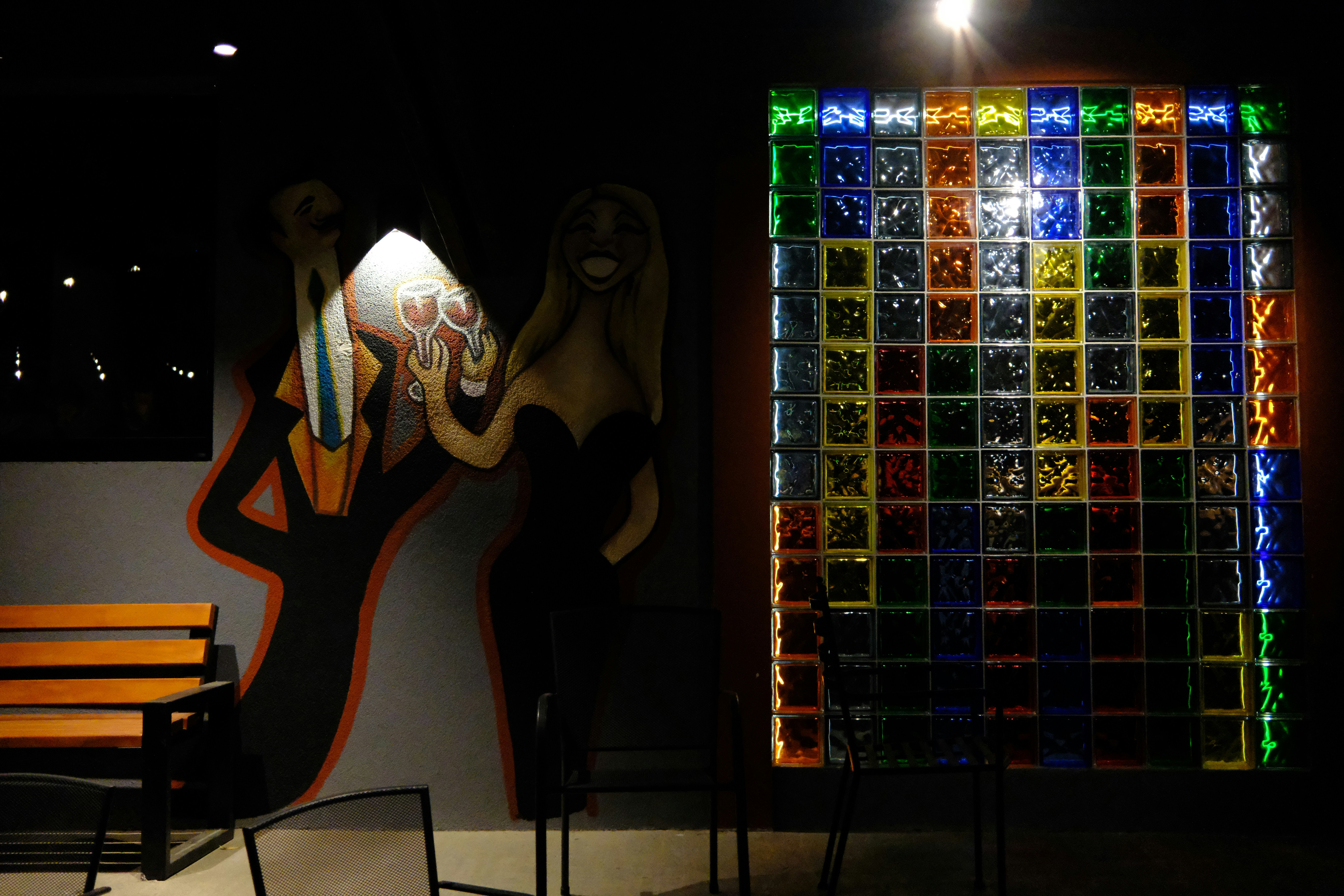 Colorful Glass Wall Meets Shadowed Gallery