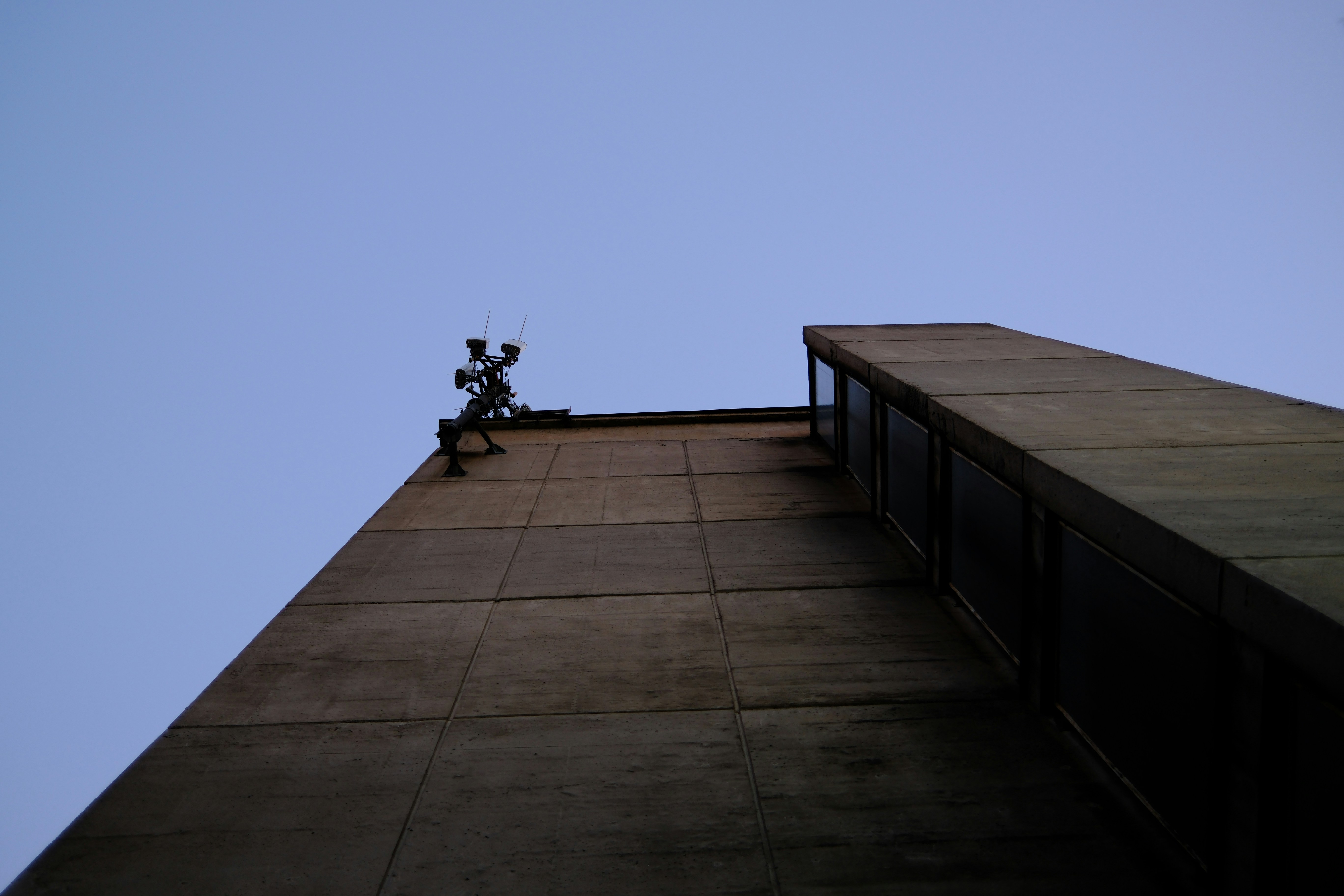 Rooftop Sentinel: A Minimalist Climb Above the City
