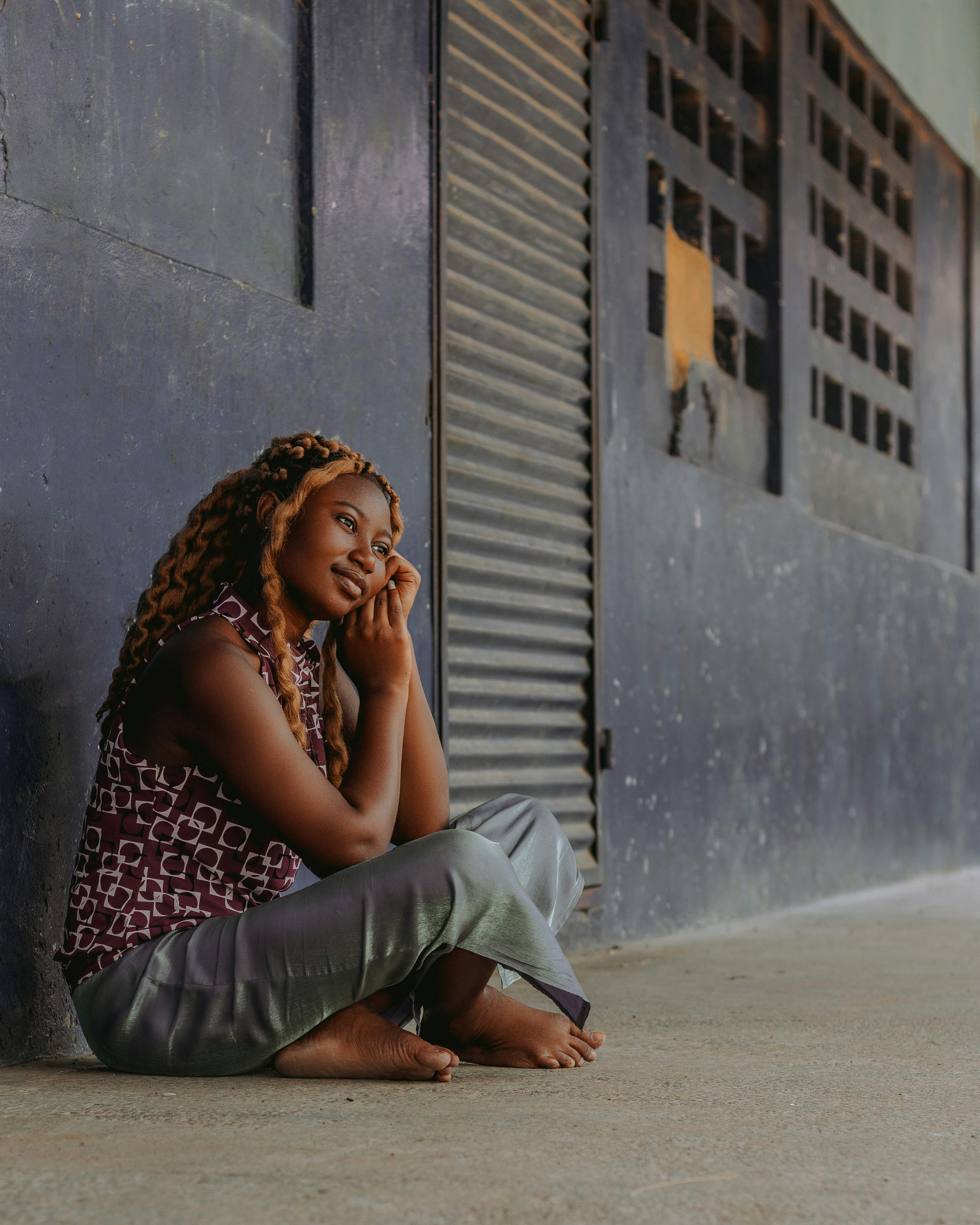 Hopeful Quiet: A Seated Portrait by the Wall