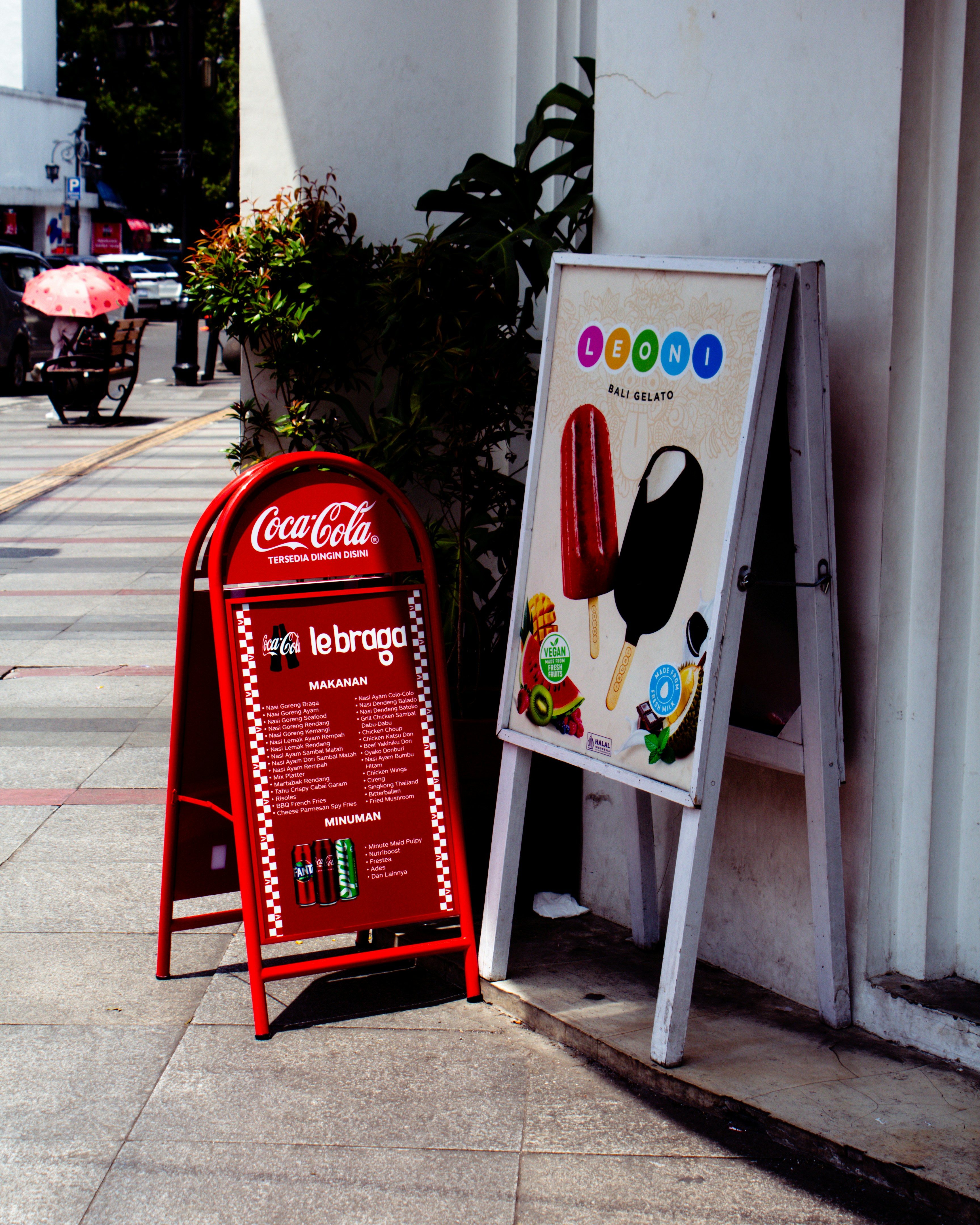 Red Menu Board by a Pale Building: Street Vitrine of Cold Treats