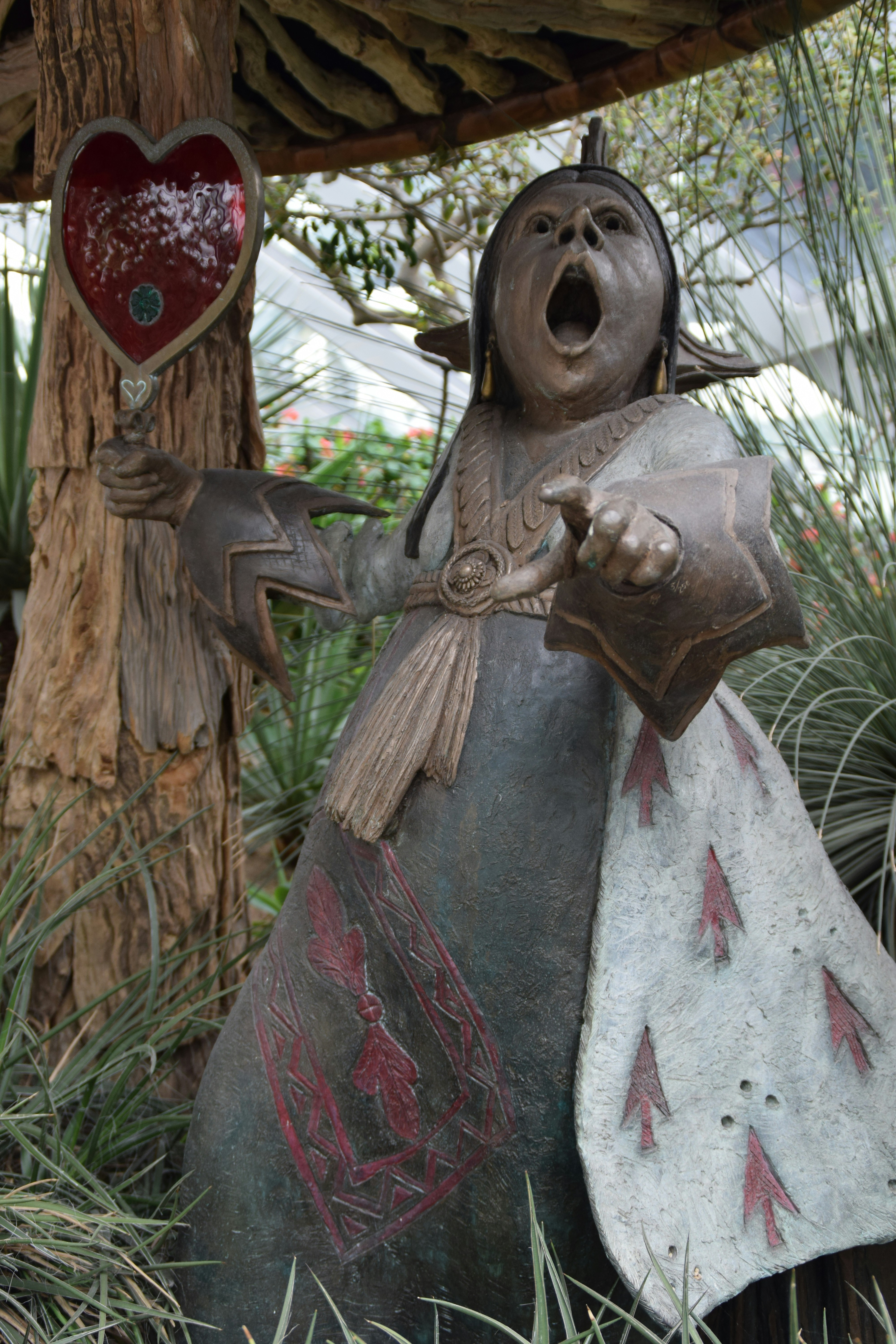 Shocked Sentinel: A Stone Queen Extends a Clasping Arm