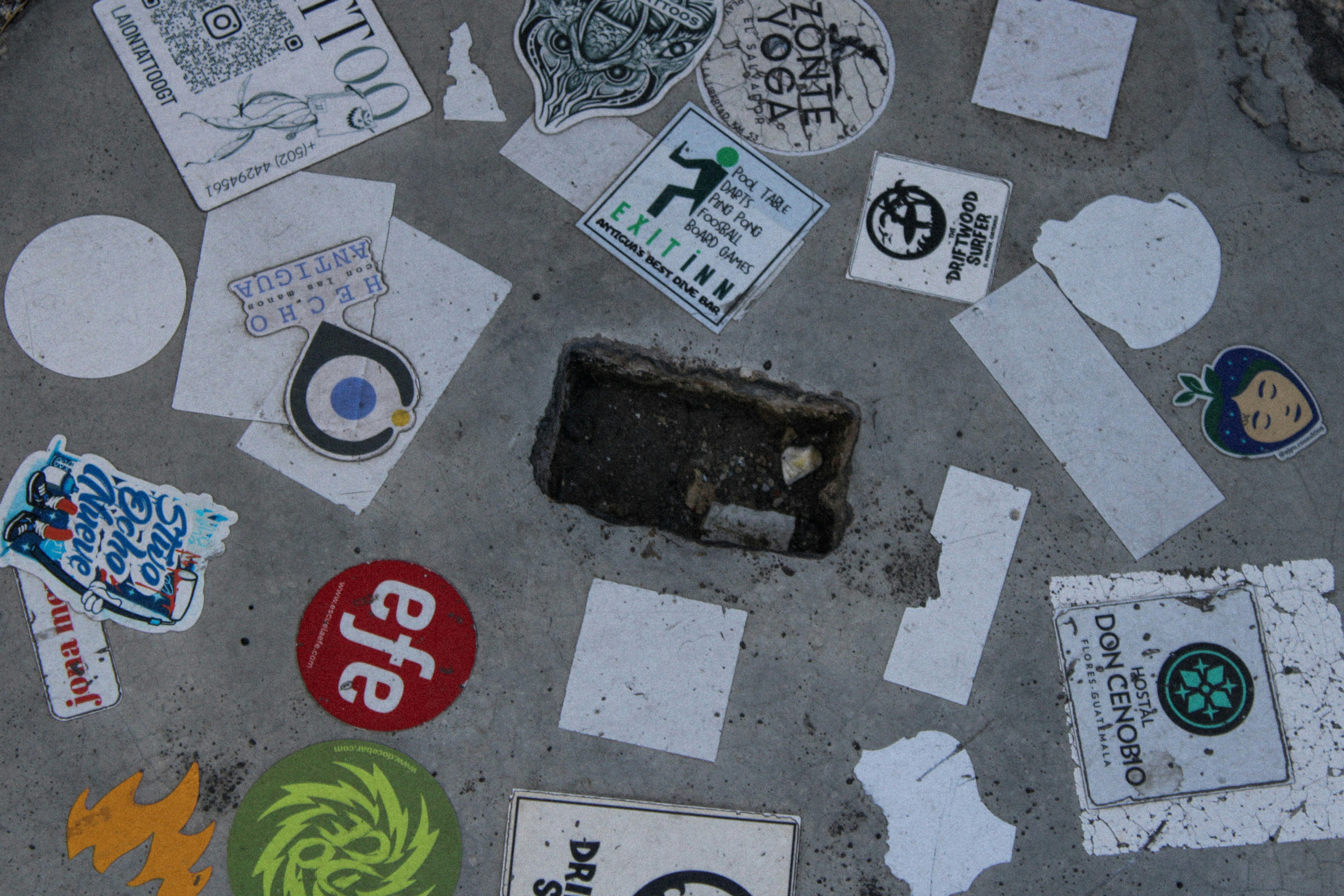 Sticker Mosaic: Urban Patchwork on a Concrete Surface