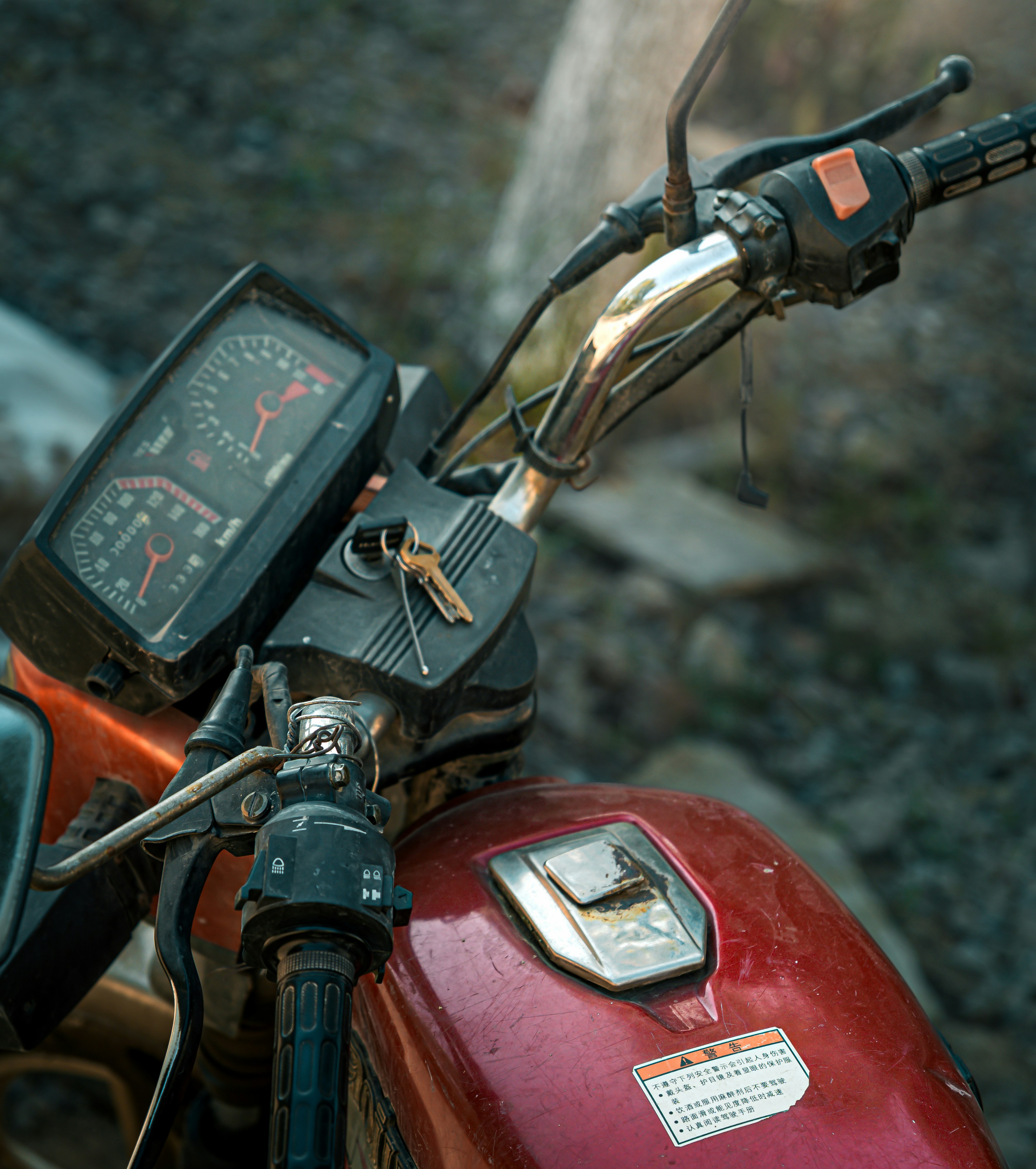 Rusted Ride, Quiet Dashboard: A Close-Up of a motorcycle Handlebar