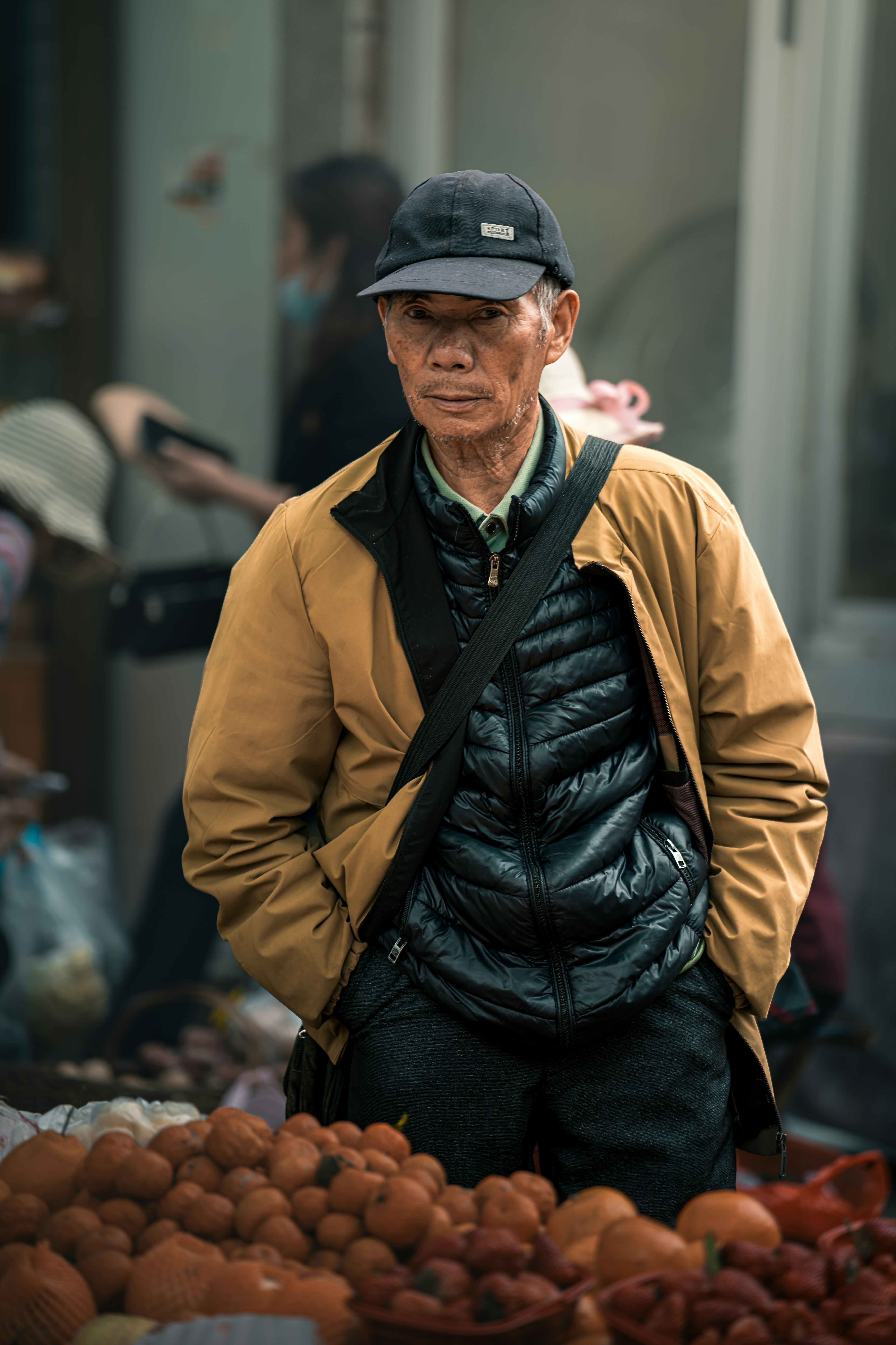 Market Scene Portrait: The Elder Vendor Amid Warm Wraps of Fruit
