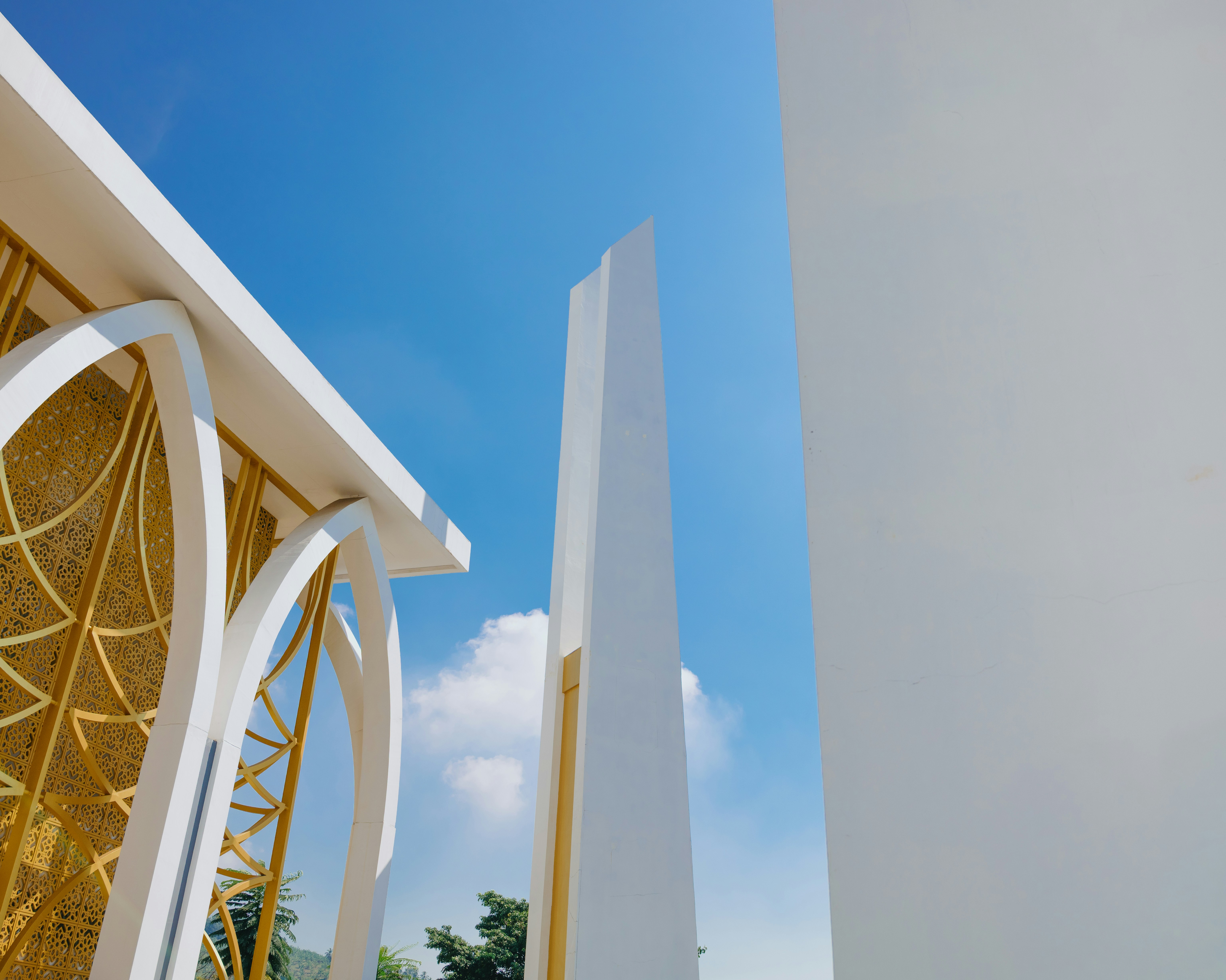 Angular Cathedral: White Pillars against a Blue Sky