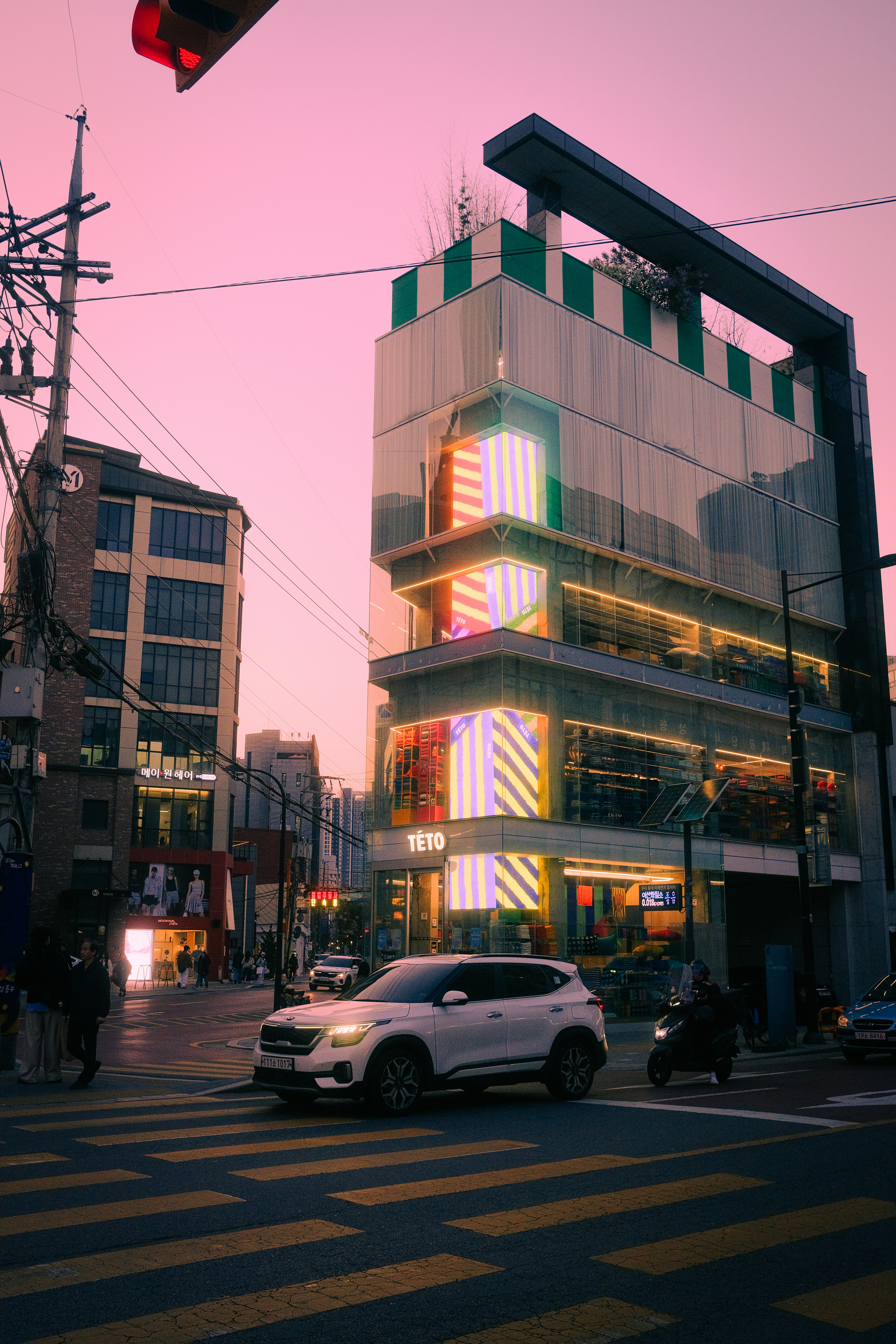 Neon Facade: Neon-lit Corner Store on a Pink Dusk Street