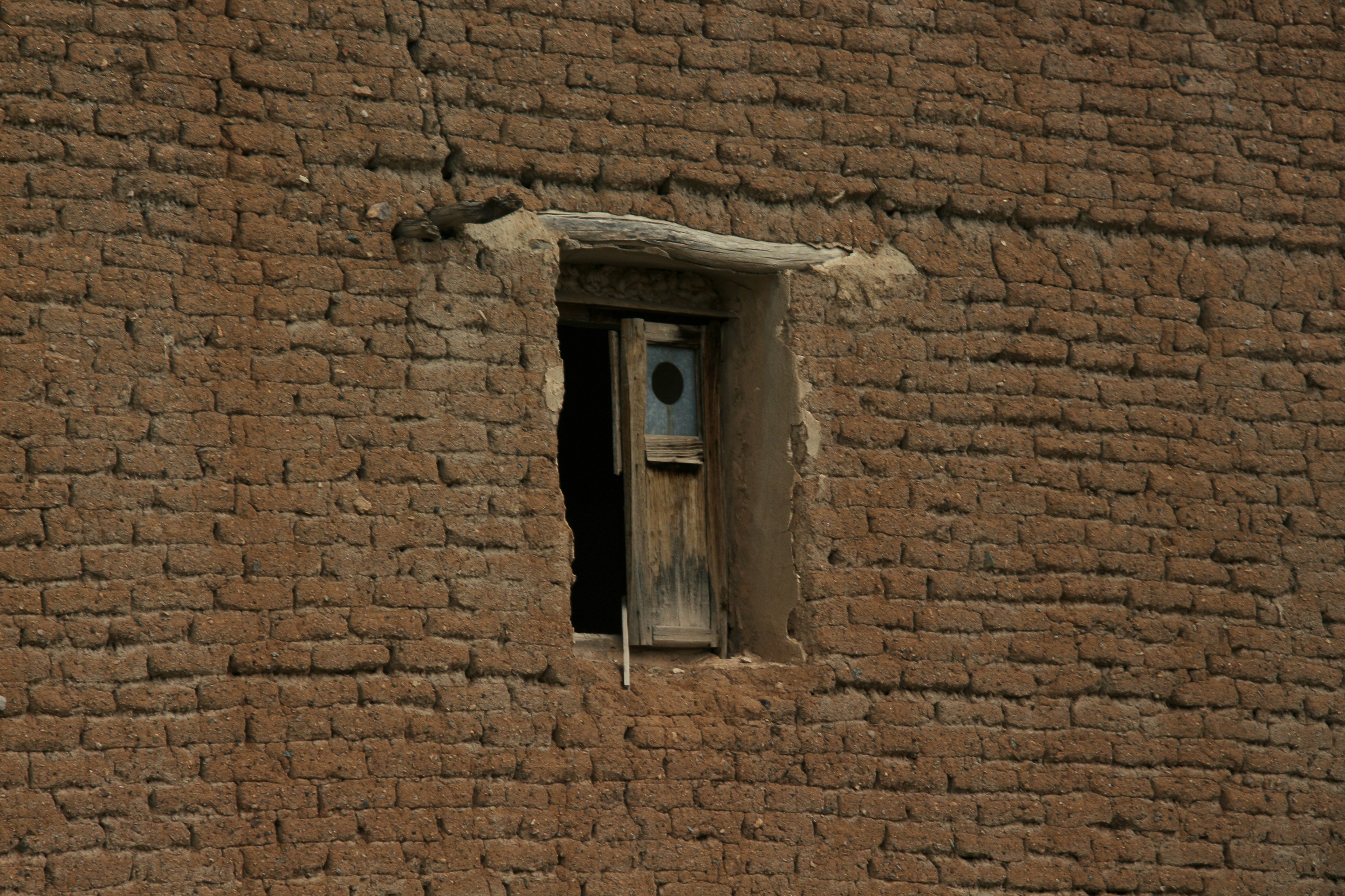 Hidden Doorway: A Quiet Vent Between Bricks