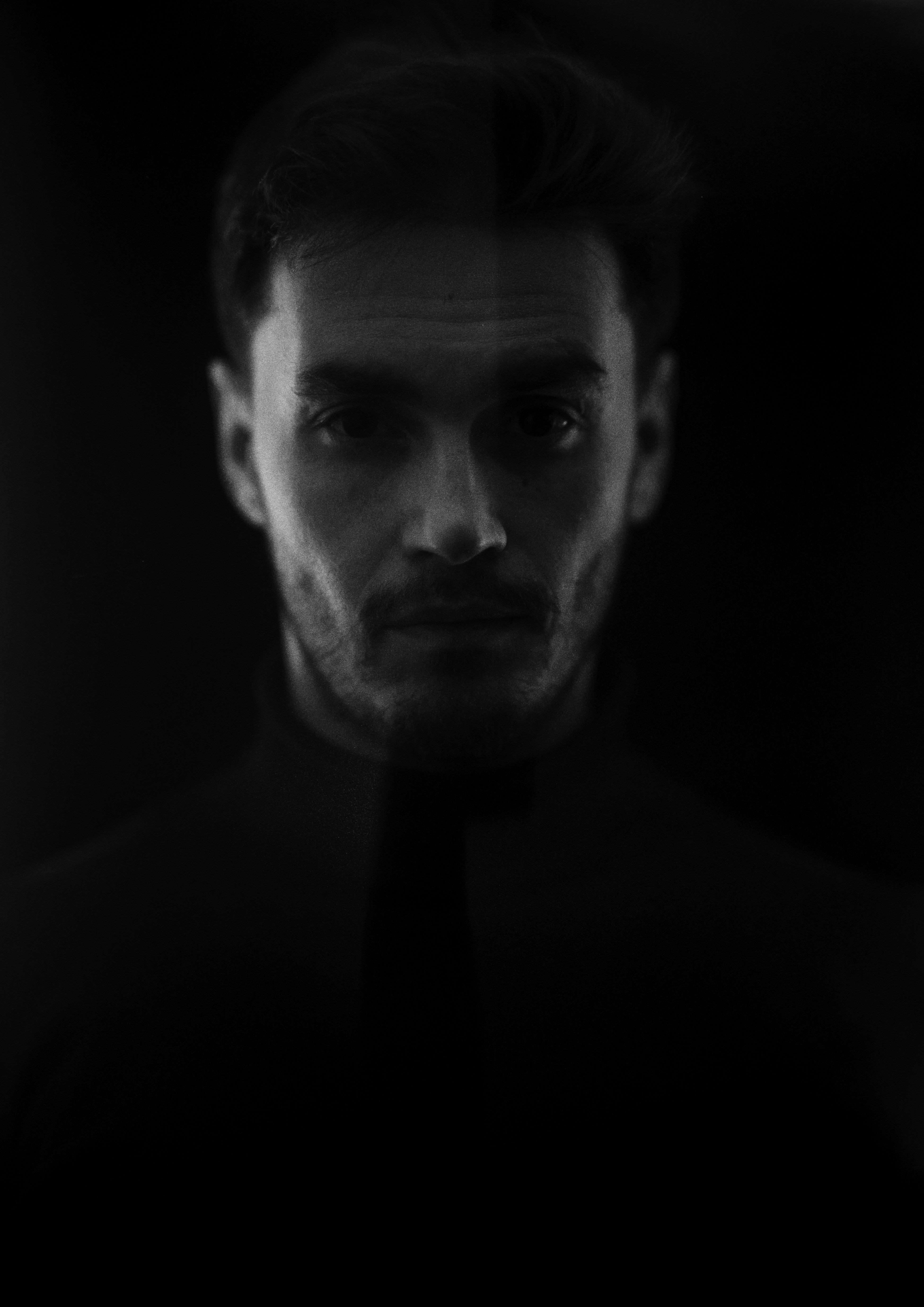 Shadowed Gaze: A Quiet Portrait in Low Light