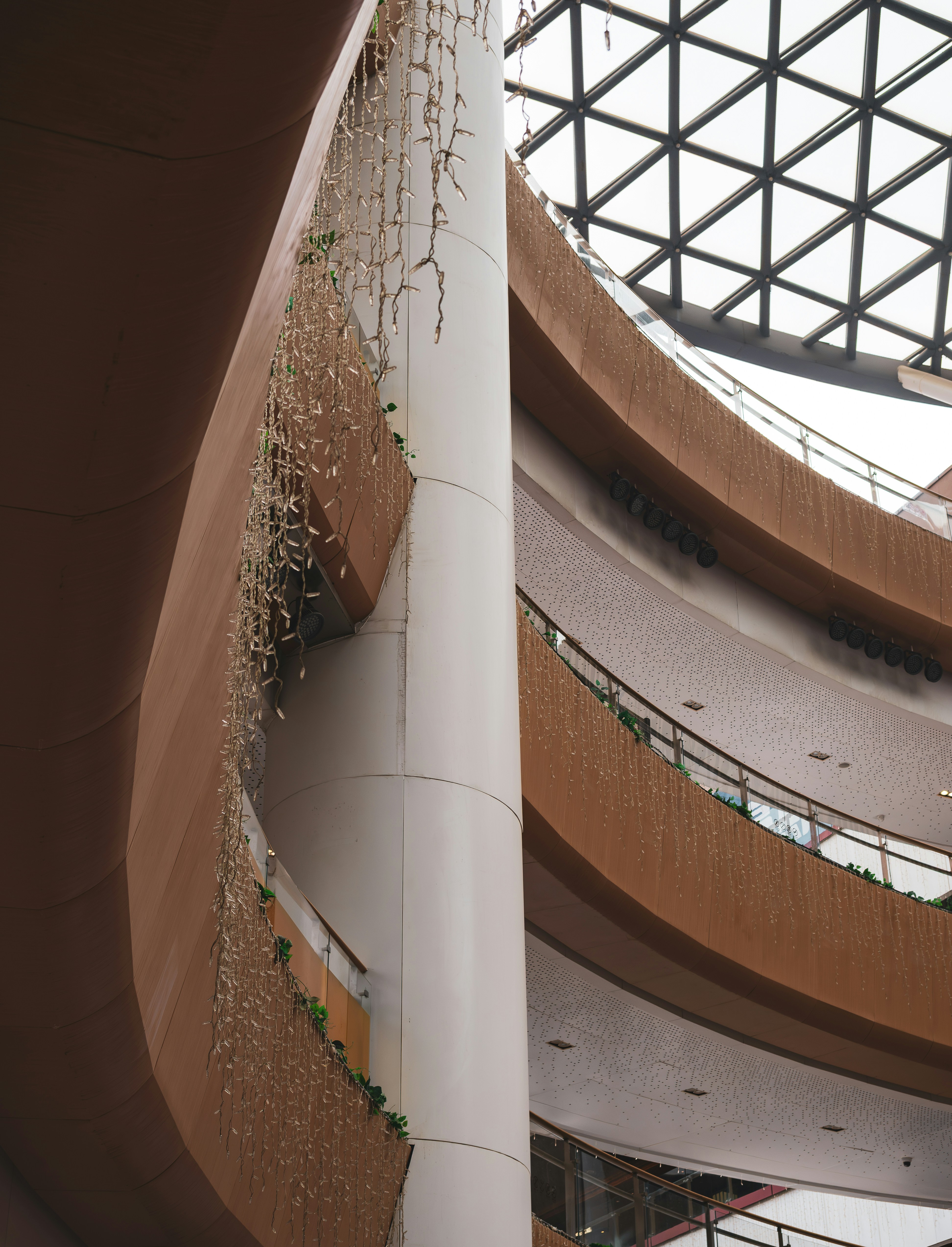 Architectural Grace: A Multi-Tier Atrium Wrapped in Light and Structure