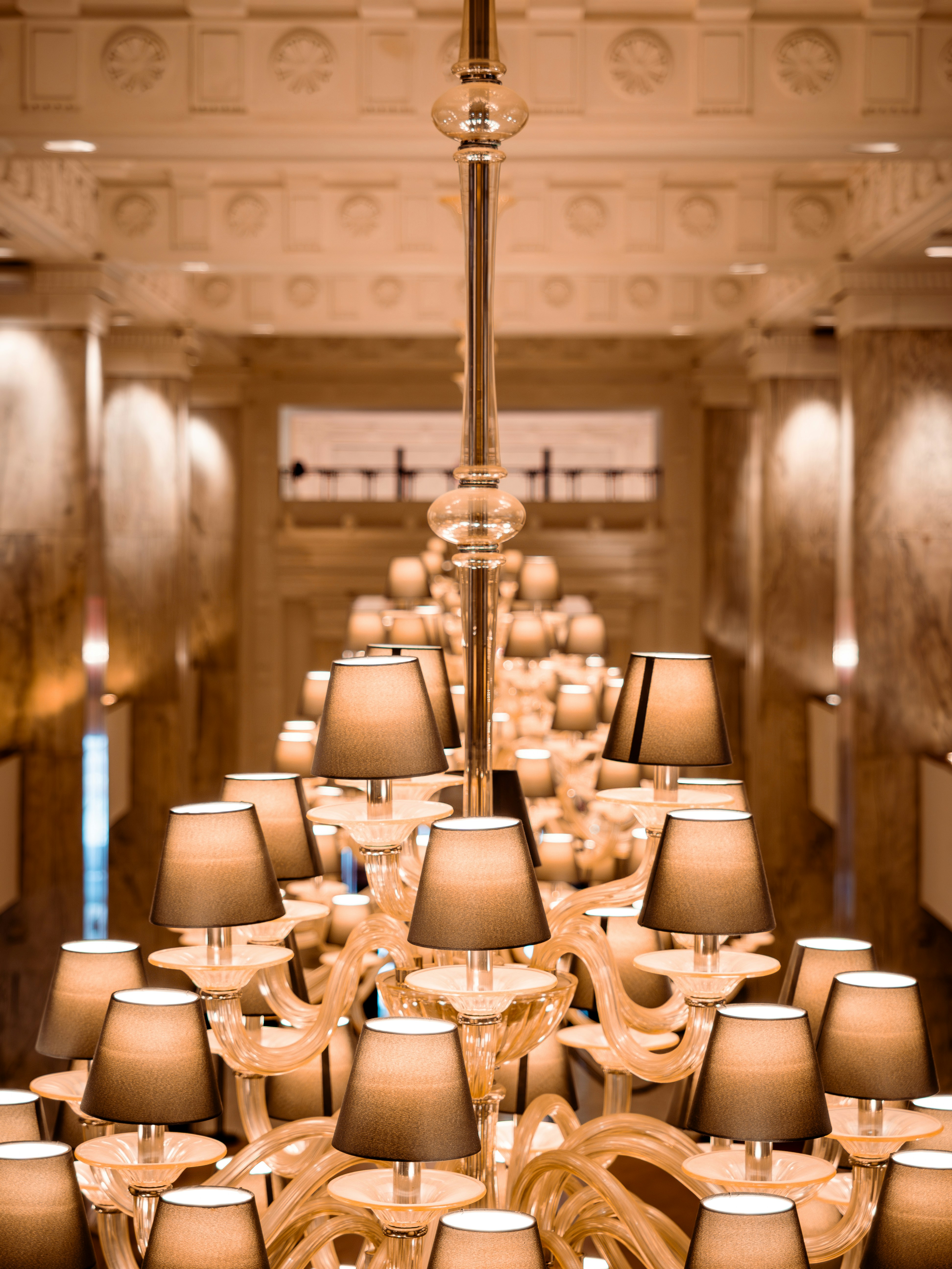 Vertical Symphony: A Tangle of Lamps in a Grand Hall