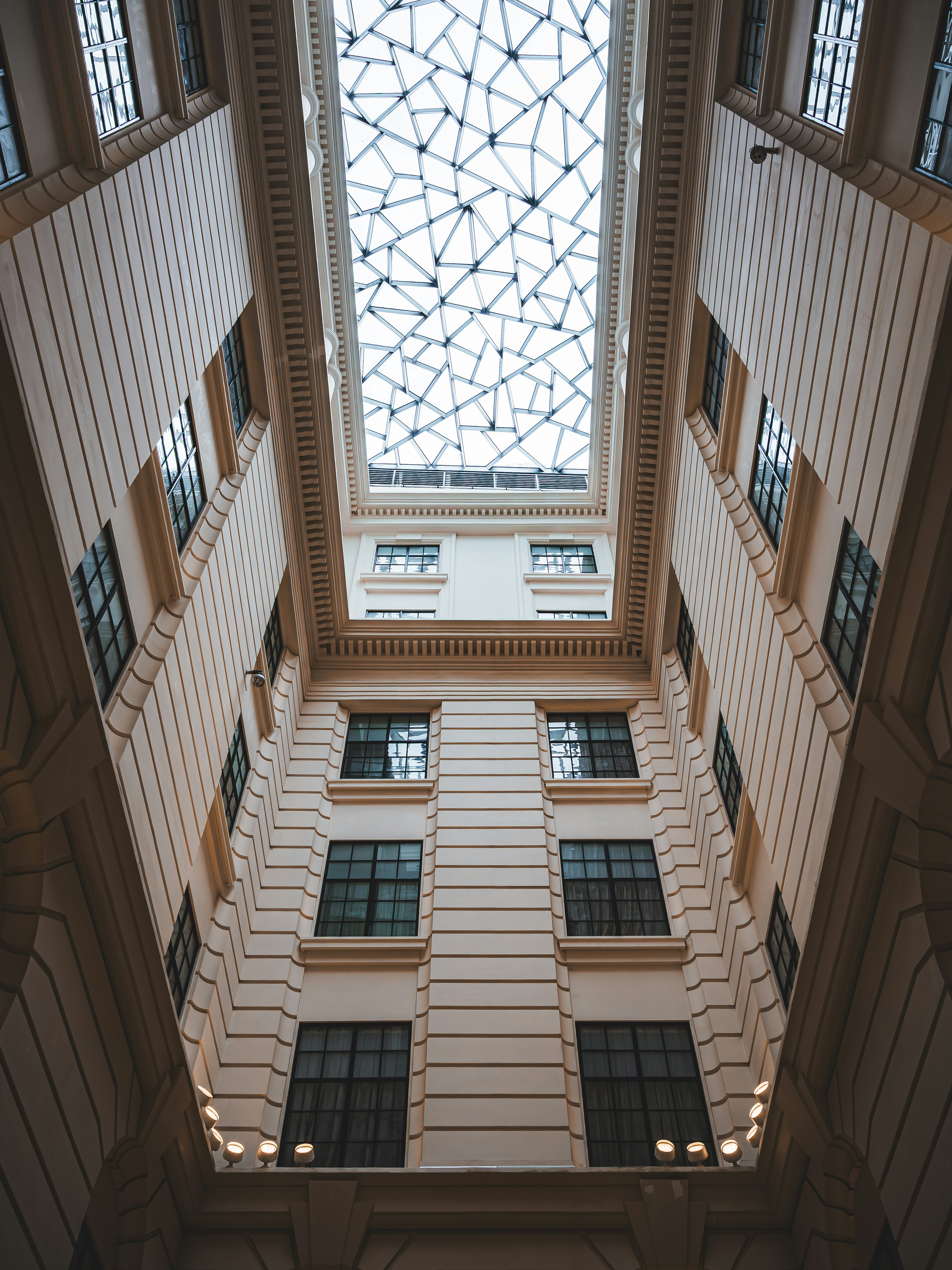 Atrium of Light: Geometric Skylight Framing an Urban Court