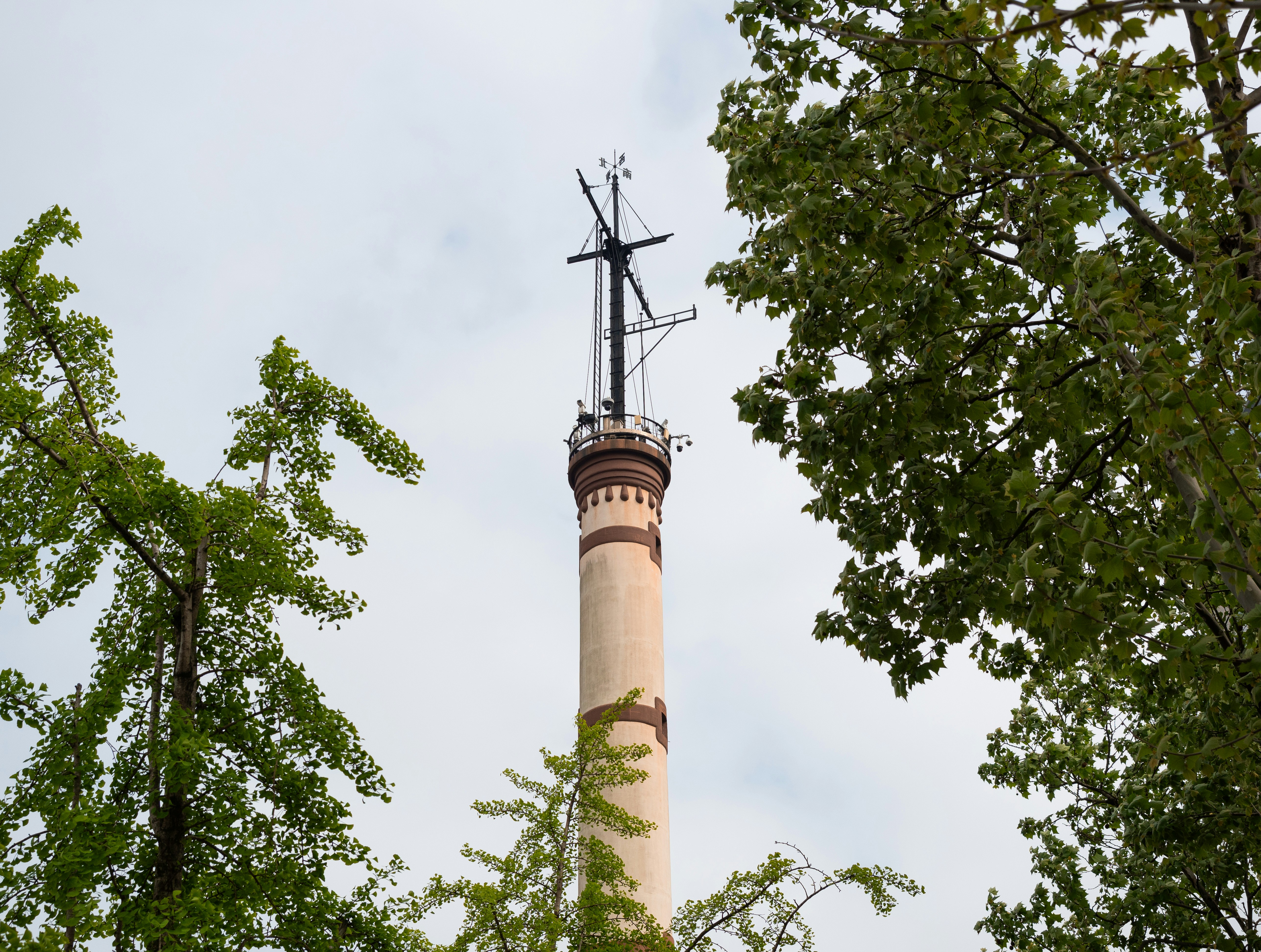 Towering Beacon Amid Green Canopy