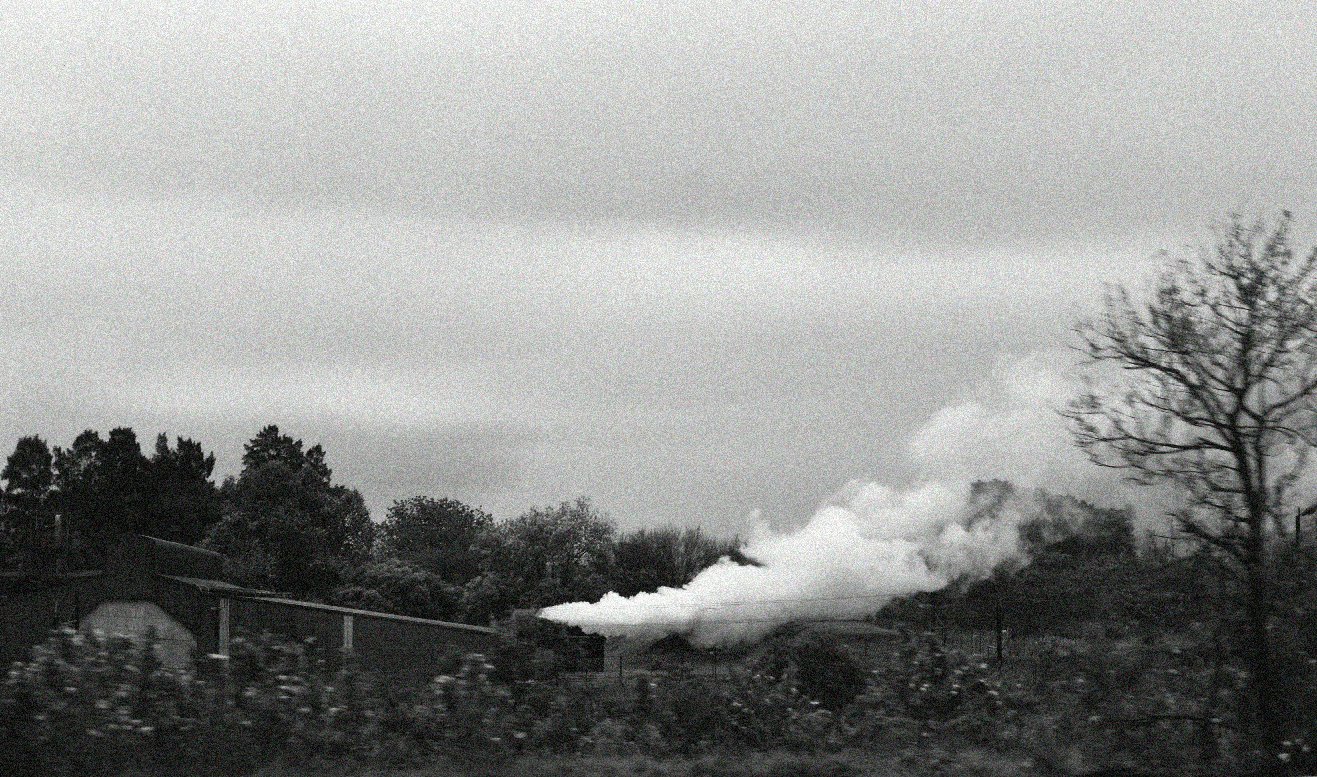 Steam Trail over the Horizon: A Quiet Industrial Wake