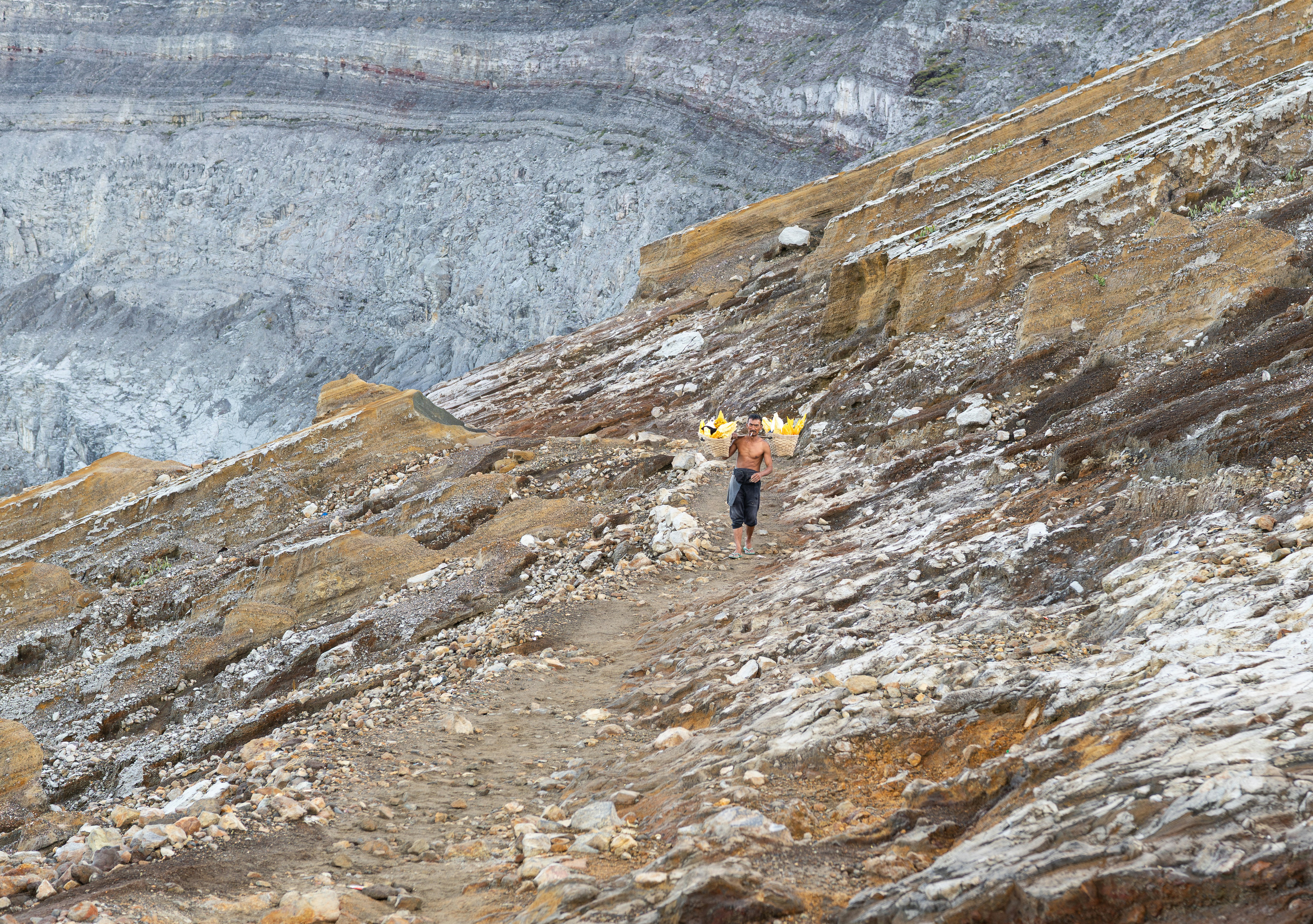 Traverse to the Ridge: Climber against a weathered mountainside