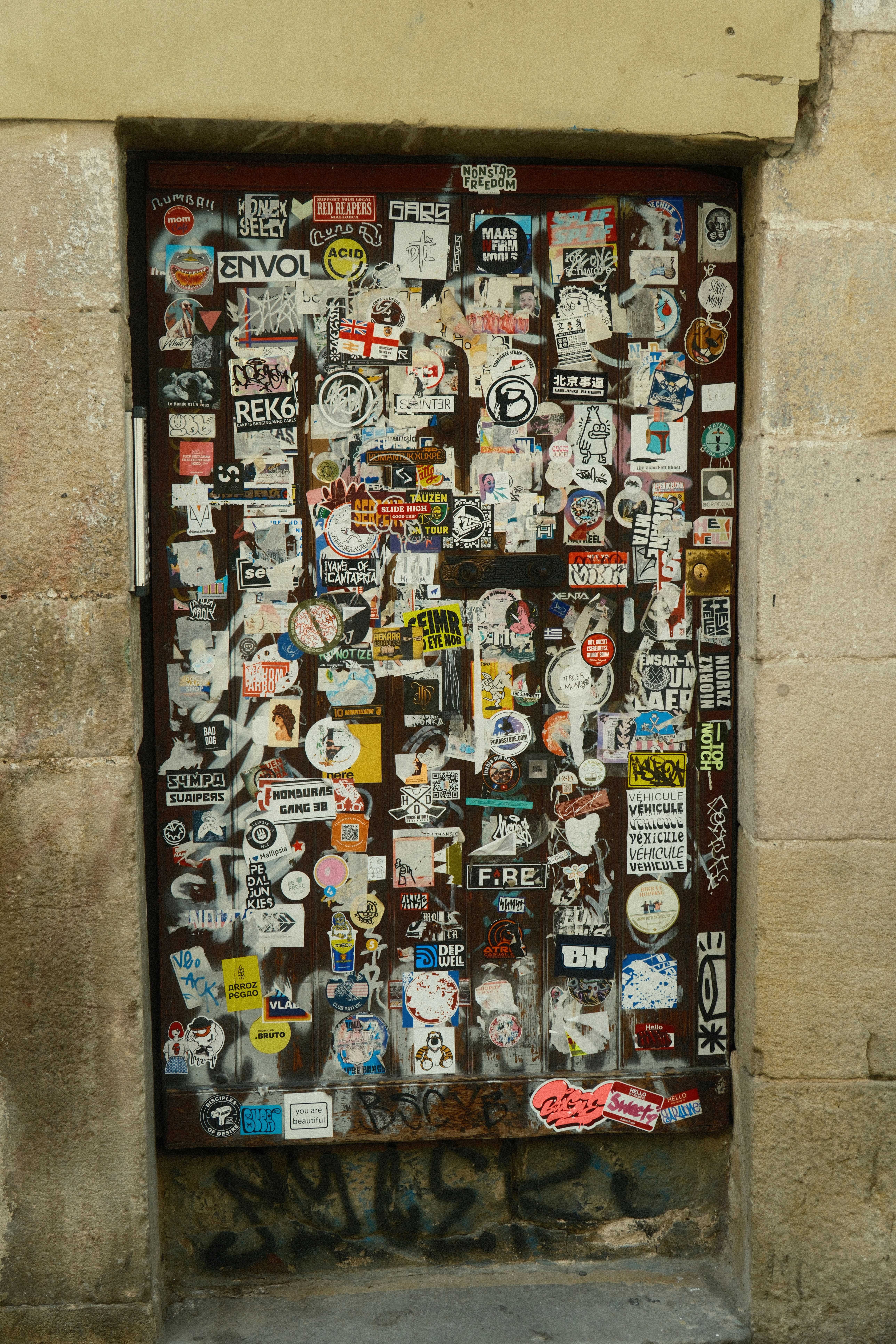 Stickered Doorway: A Kaleidoscope of Urban Expressions