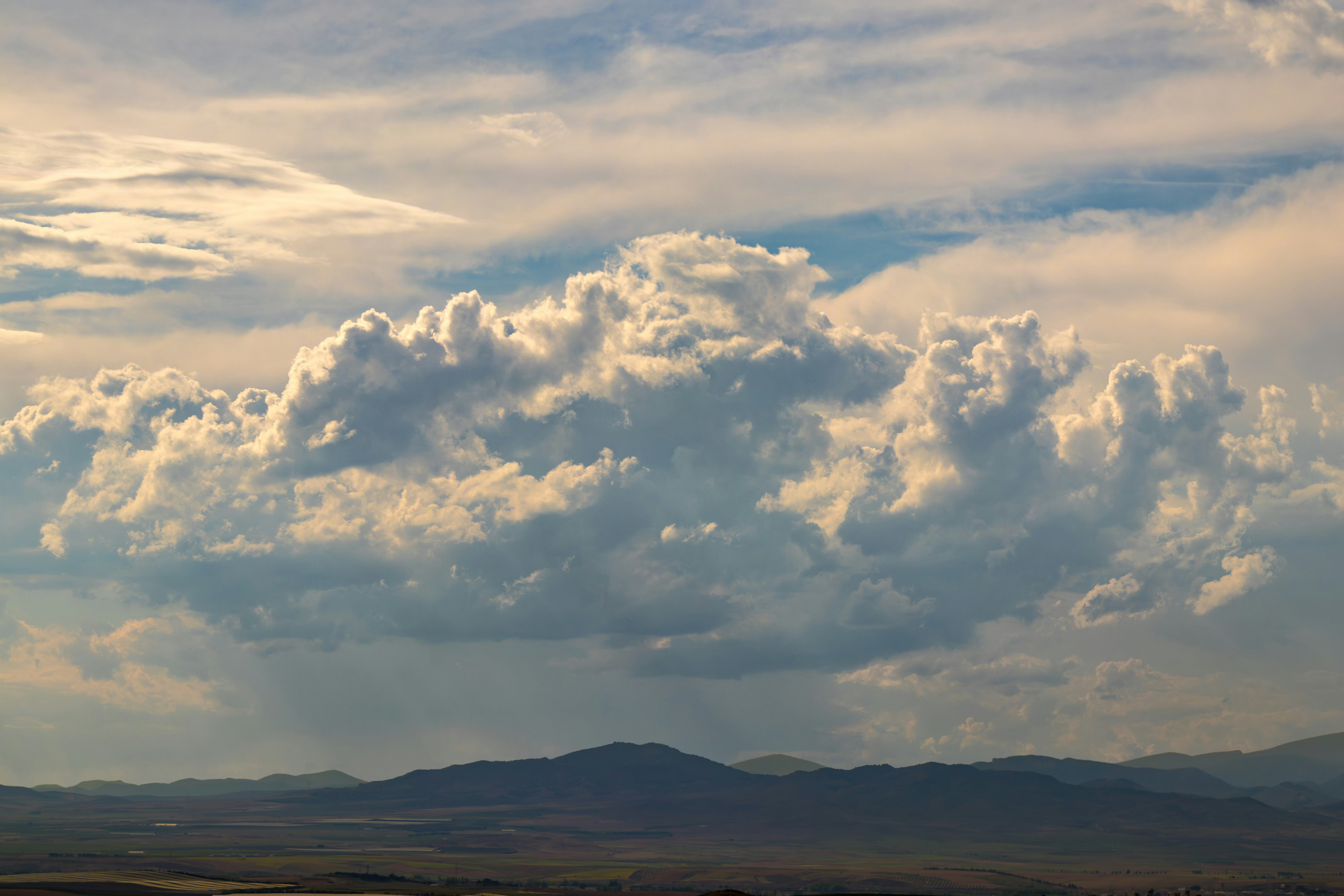 Low-Slung Horizon Under Expansive Cumulus Sky