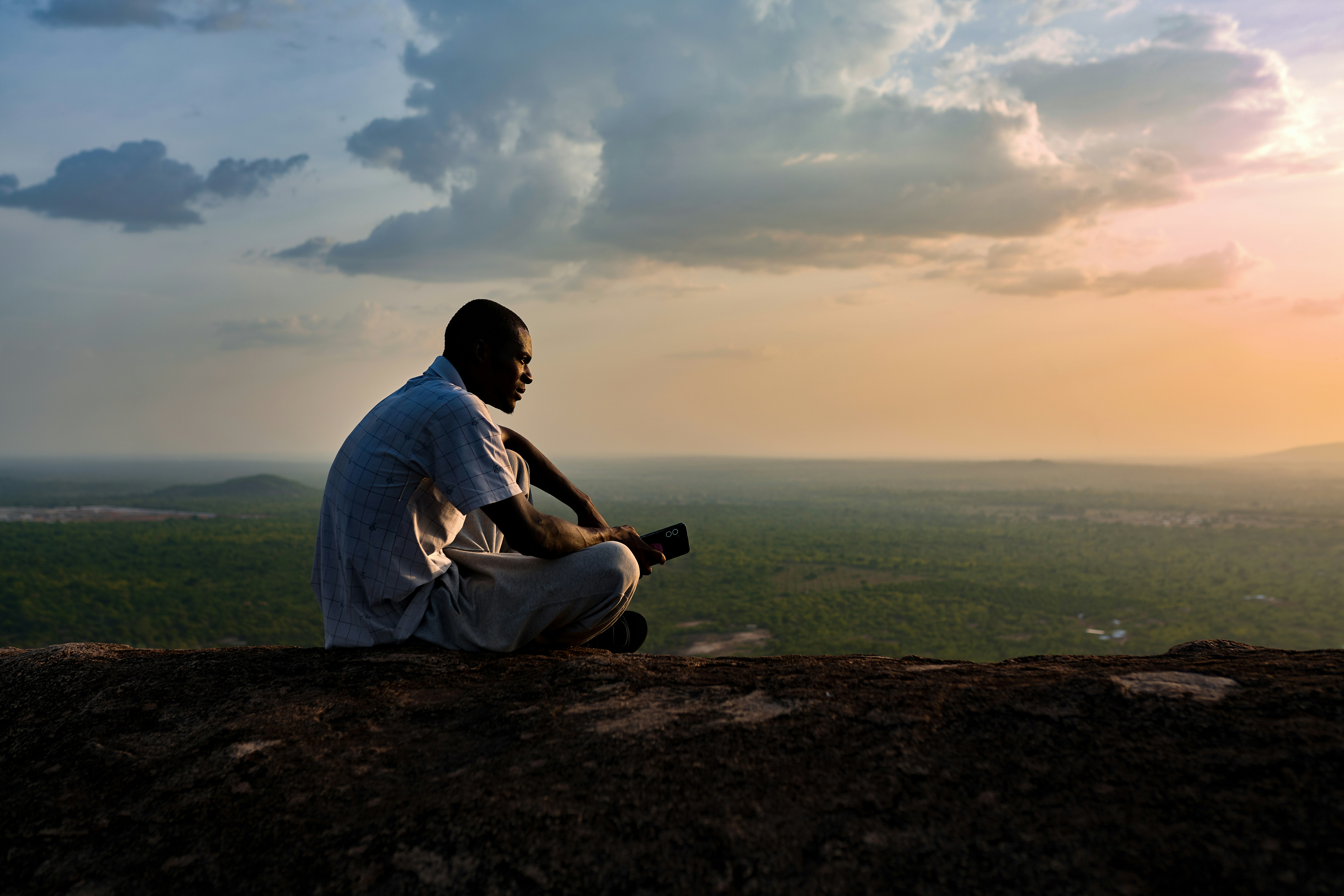 Silhouette at Dusk: A Moment of Contemplation on the Canyon Rim