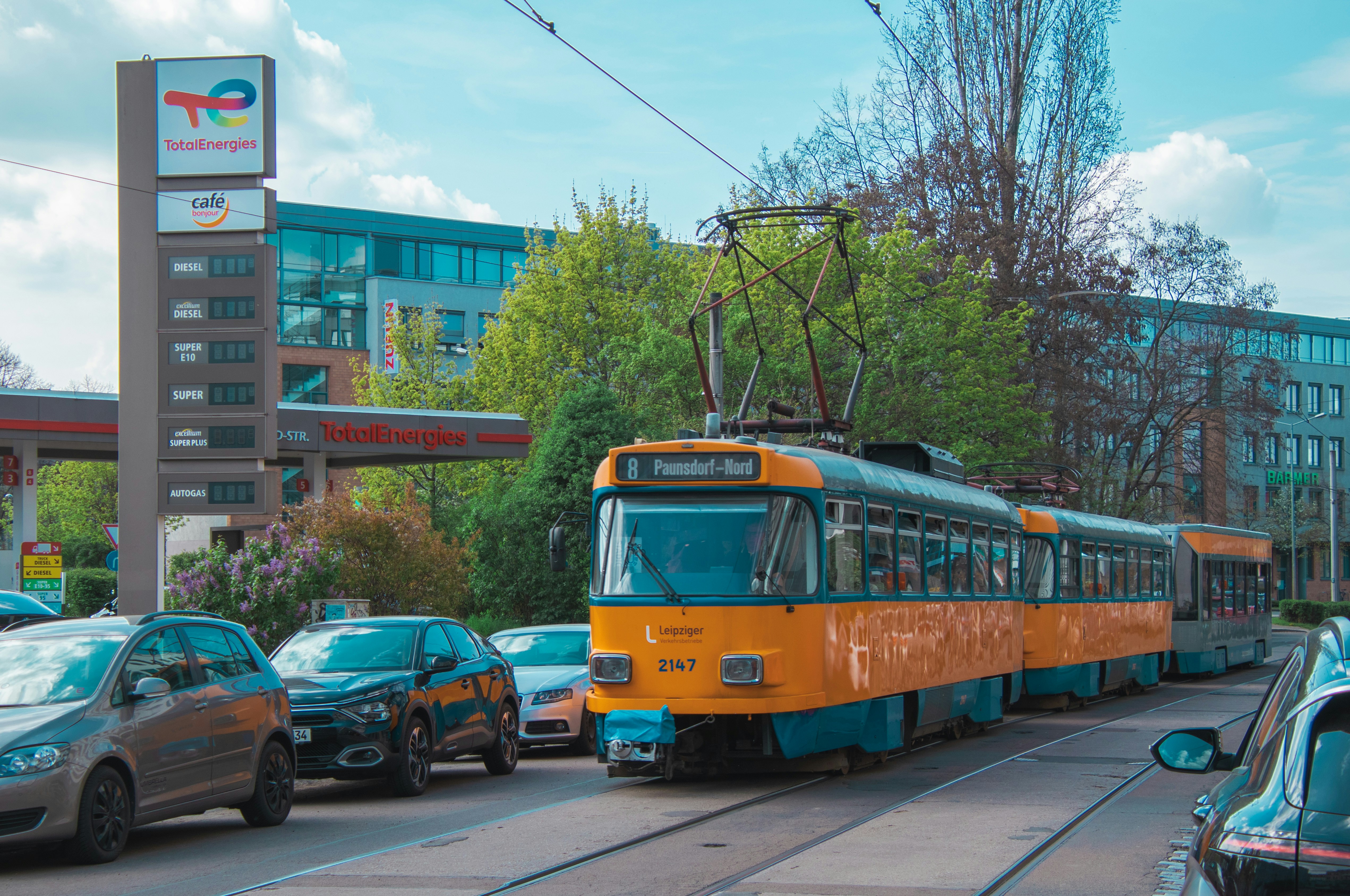 Urban Tram in a Sunlit Street: A Moment of Transit Life