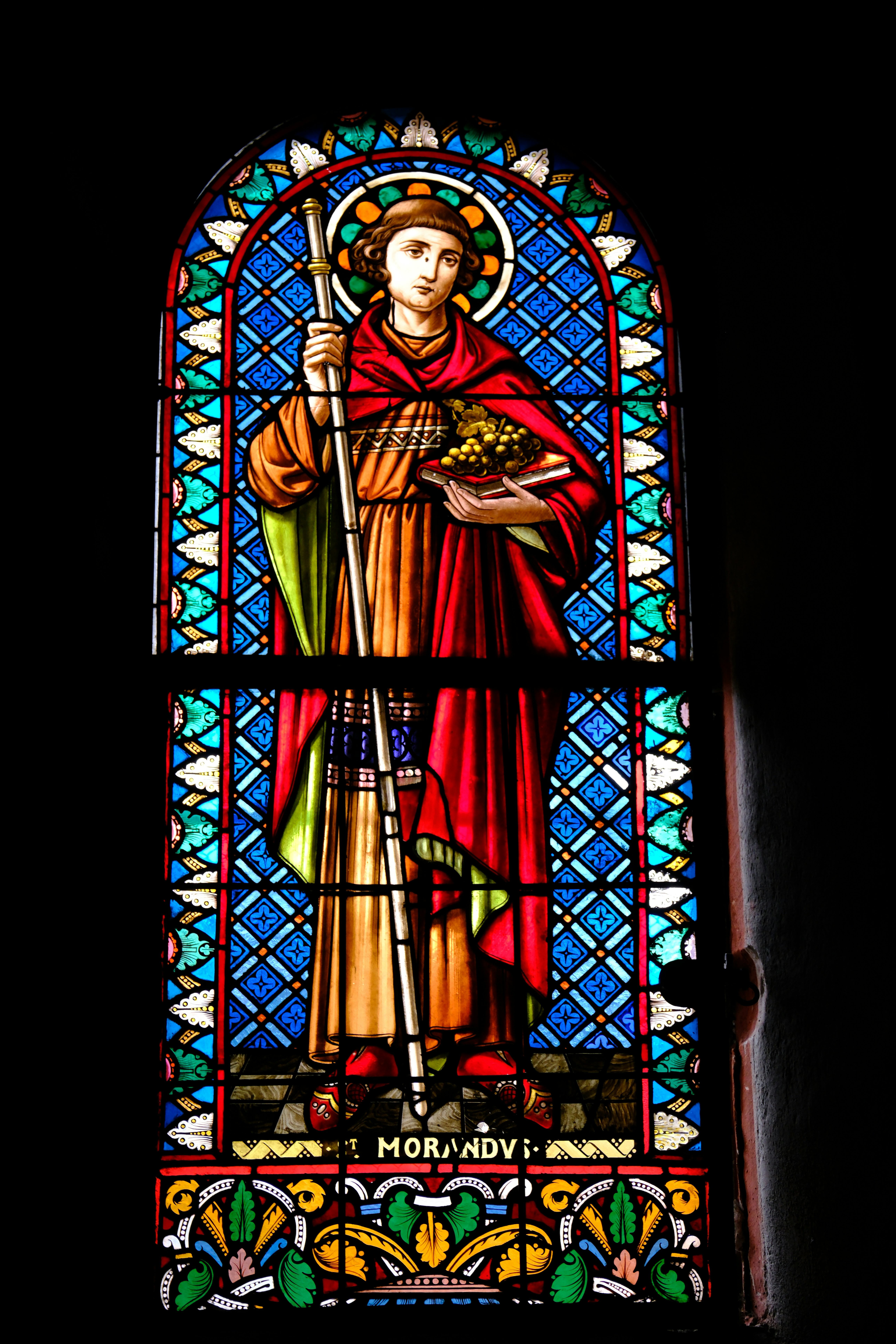 Stained Glass Saint: Vivid Portrait in Cathedral Light