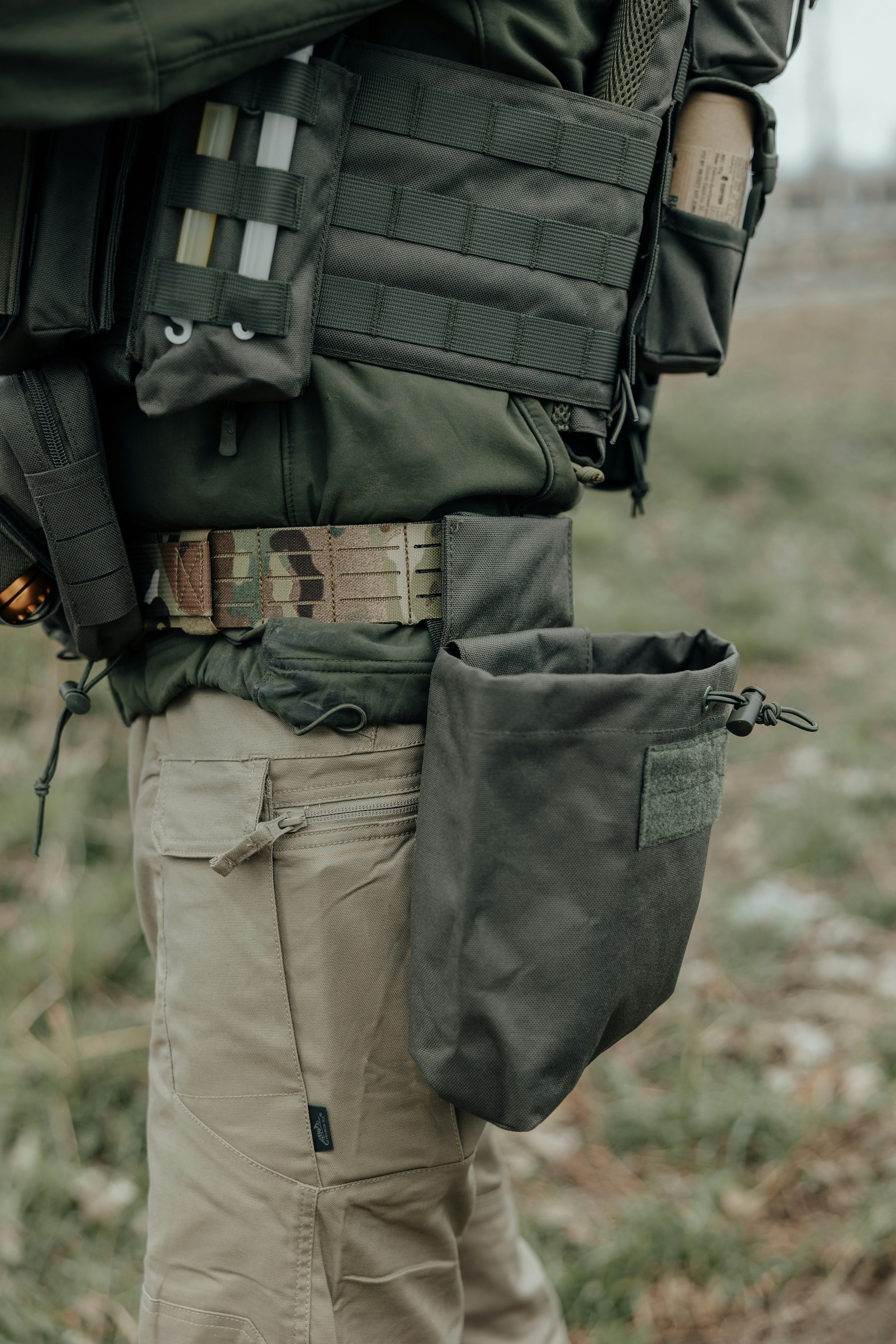 Close-Up of Tactical Utility: Harness and Pouches on a Soldier's Gear