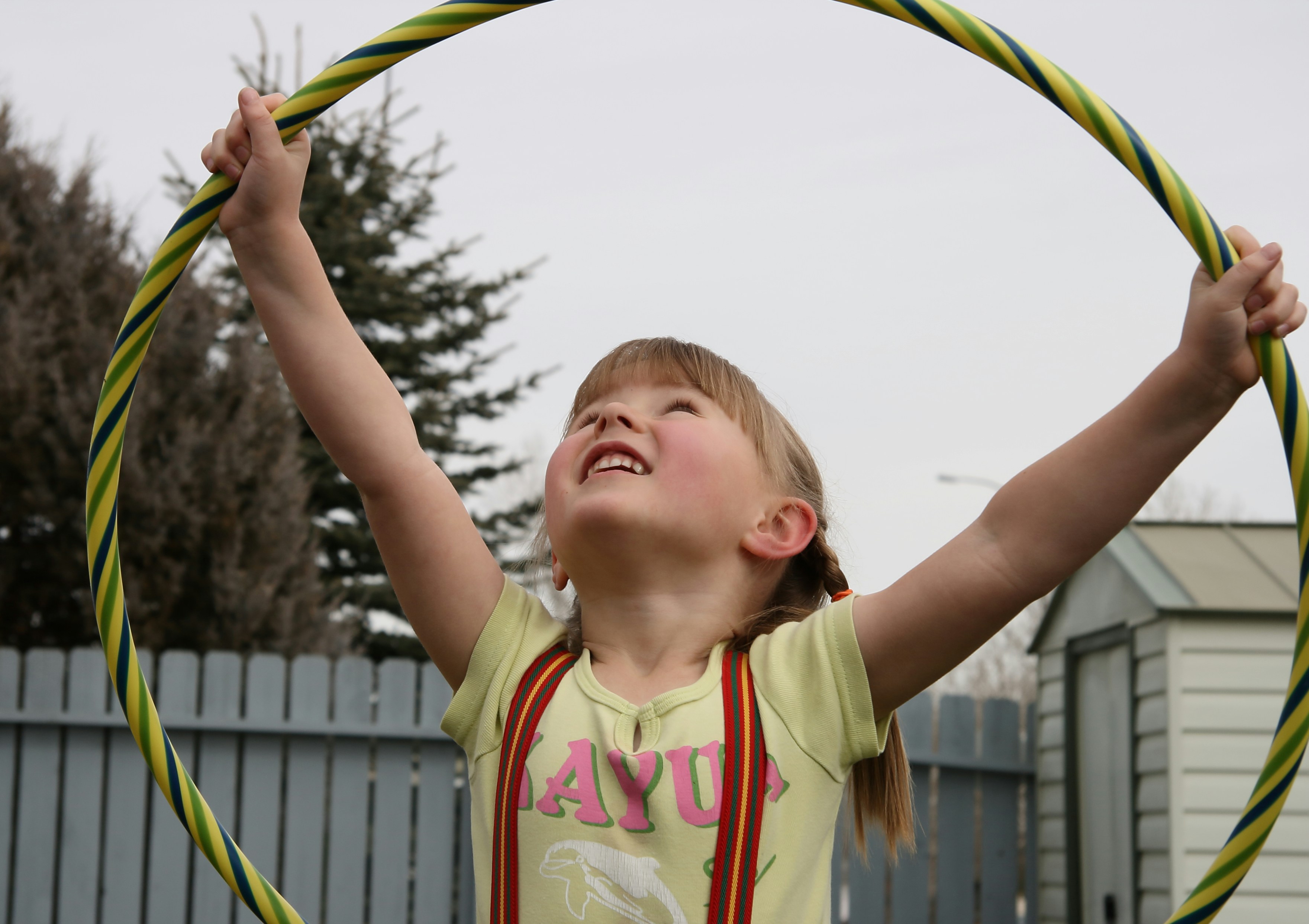 Joyful Hoop: A Little Athlete Reaches for the Sky