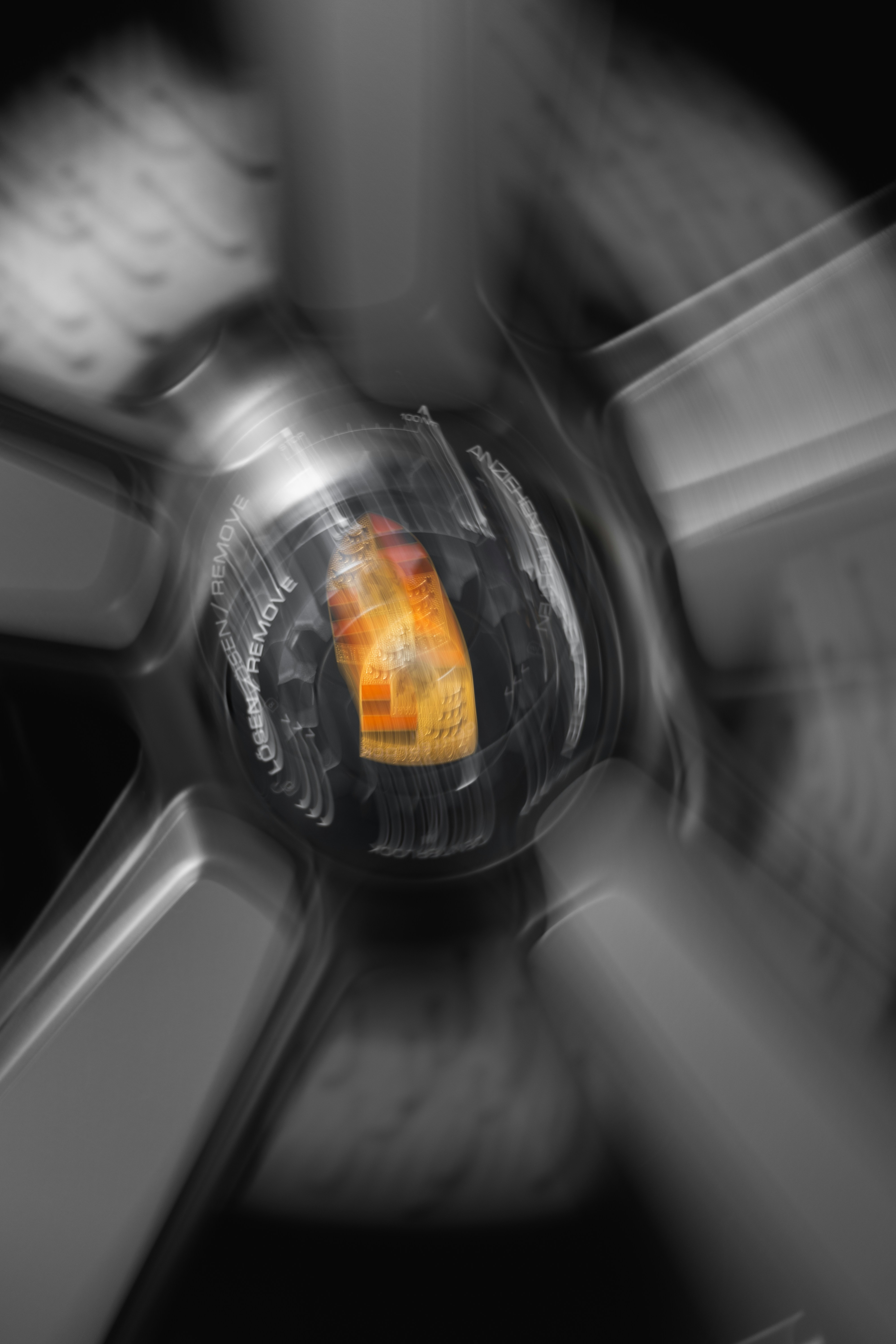 Spin of the Lens: Macro of a Camera Wheel in Motion Blur