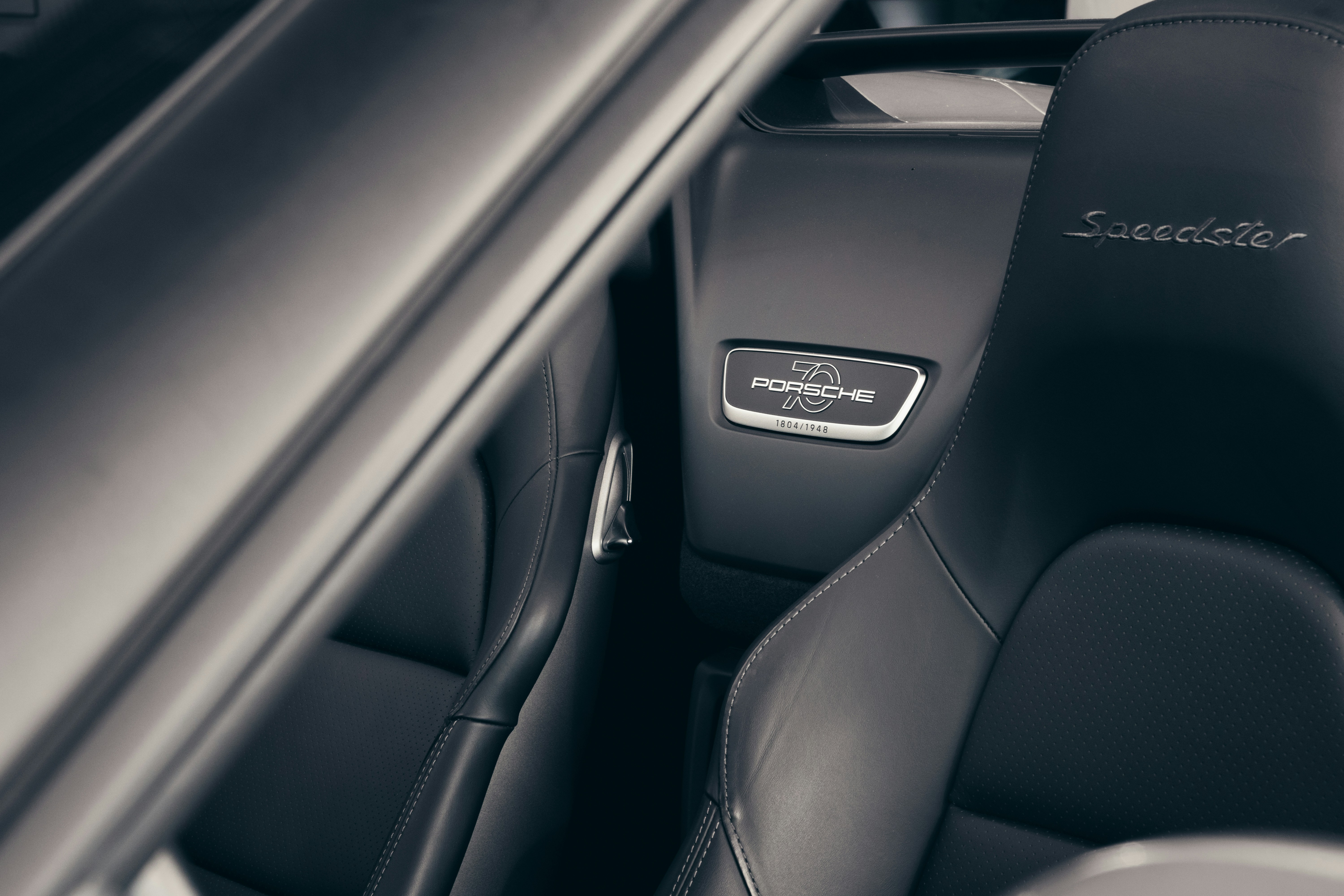 Sculpted comfort: the car’s seat and badge in a premium cabin
