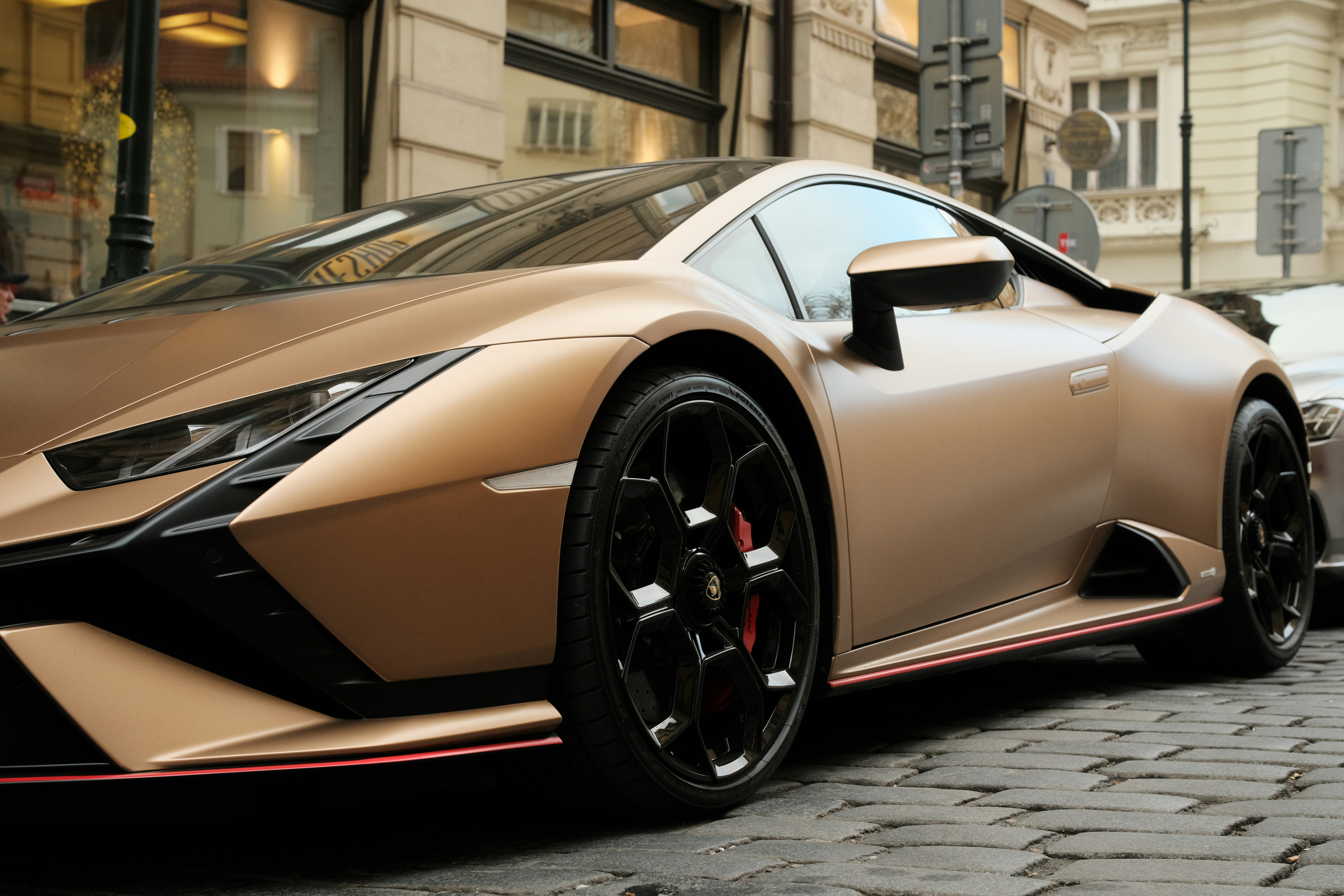 Golden Hour Predator: A Matte-Lacquer Hypercar Silhouette Resting on Cobblestones