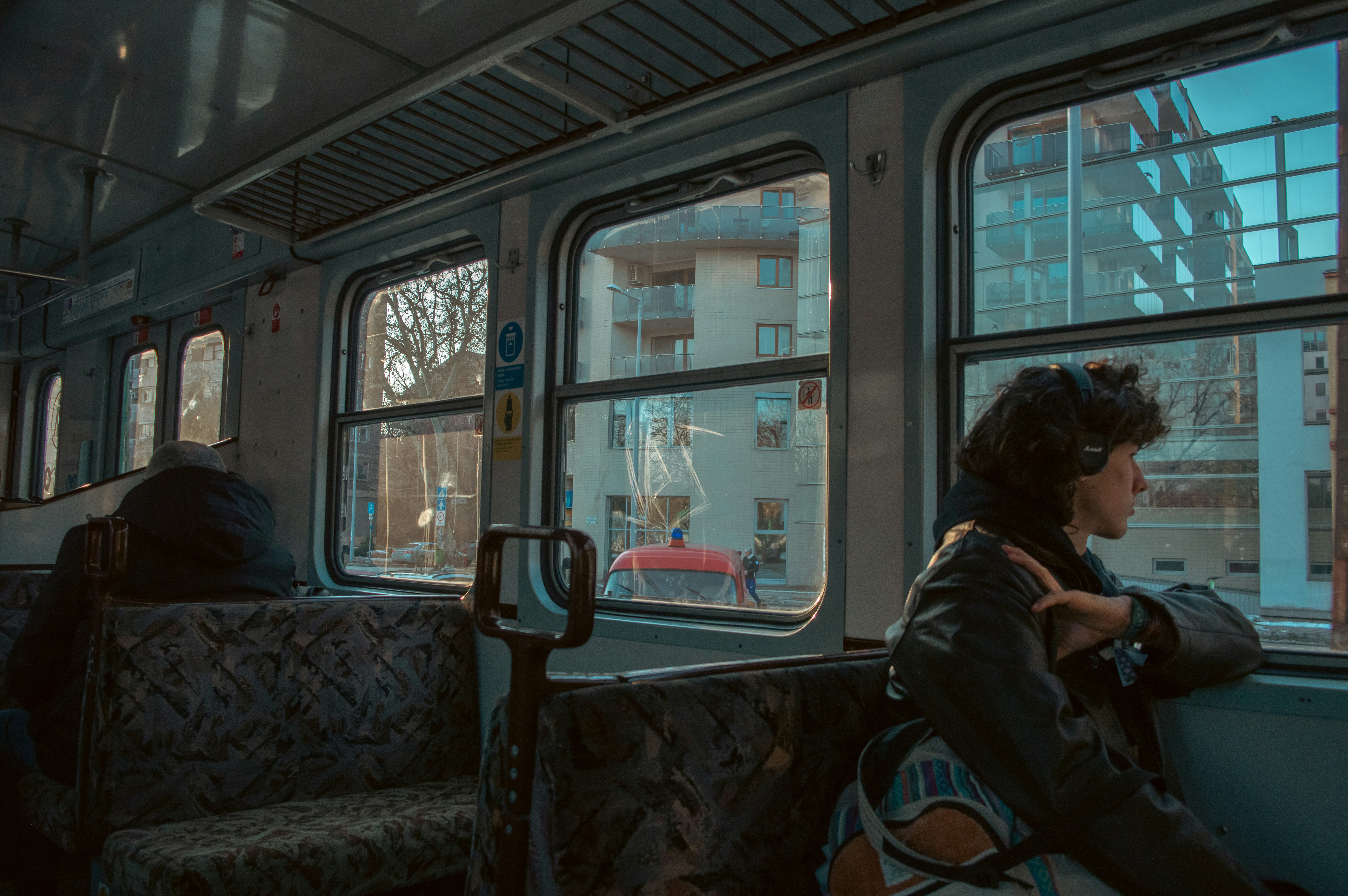 Quiet Train Window: A Moment of Pause with a Stranger in Transit