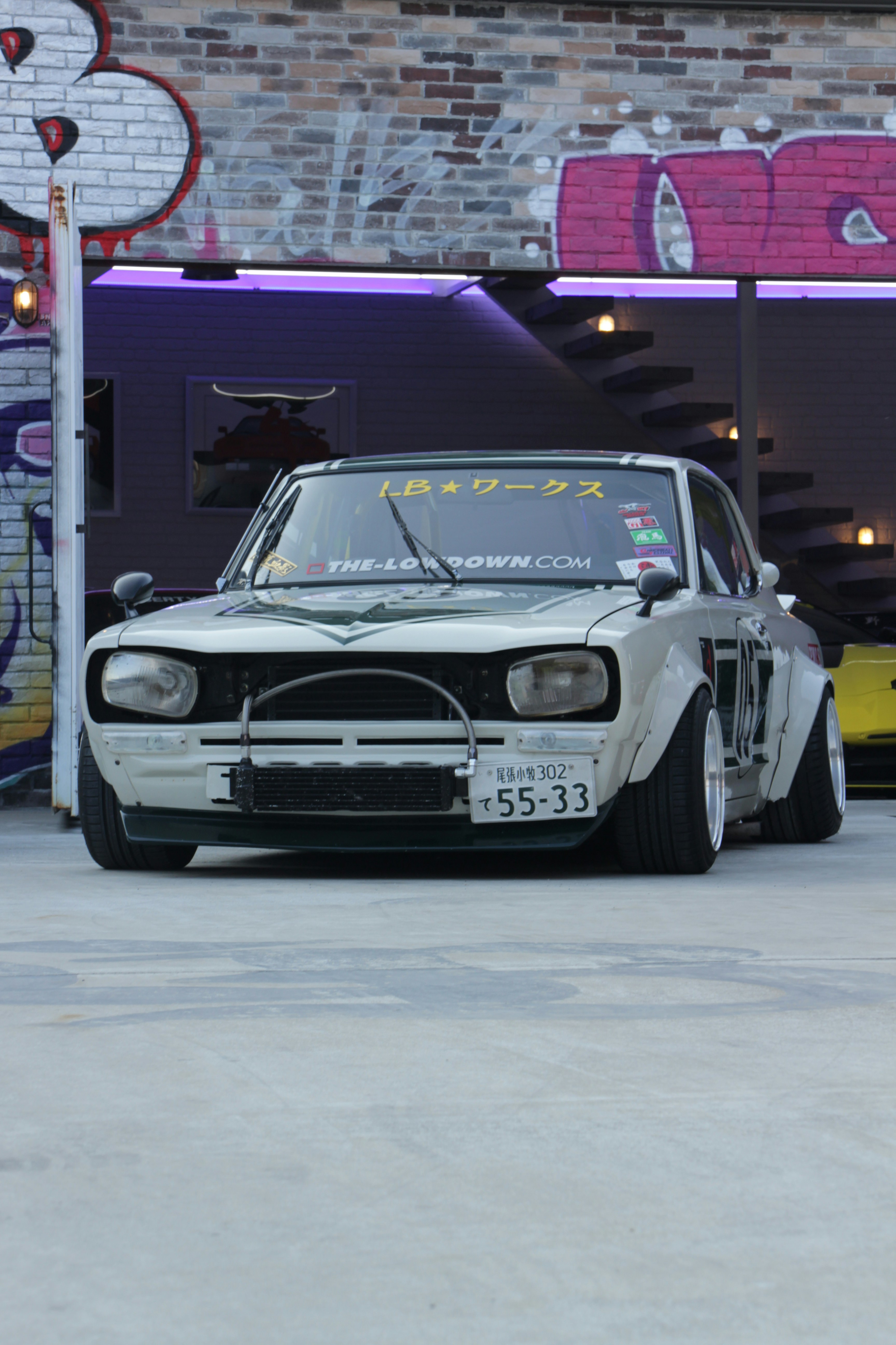 Grey Skyline: A Civic Stance in Neon Graffiti