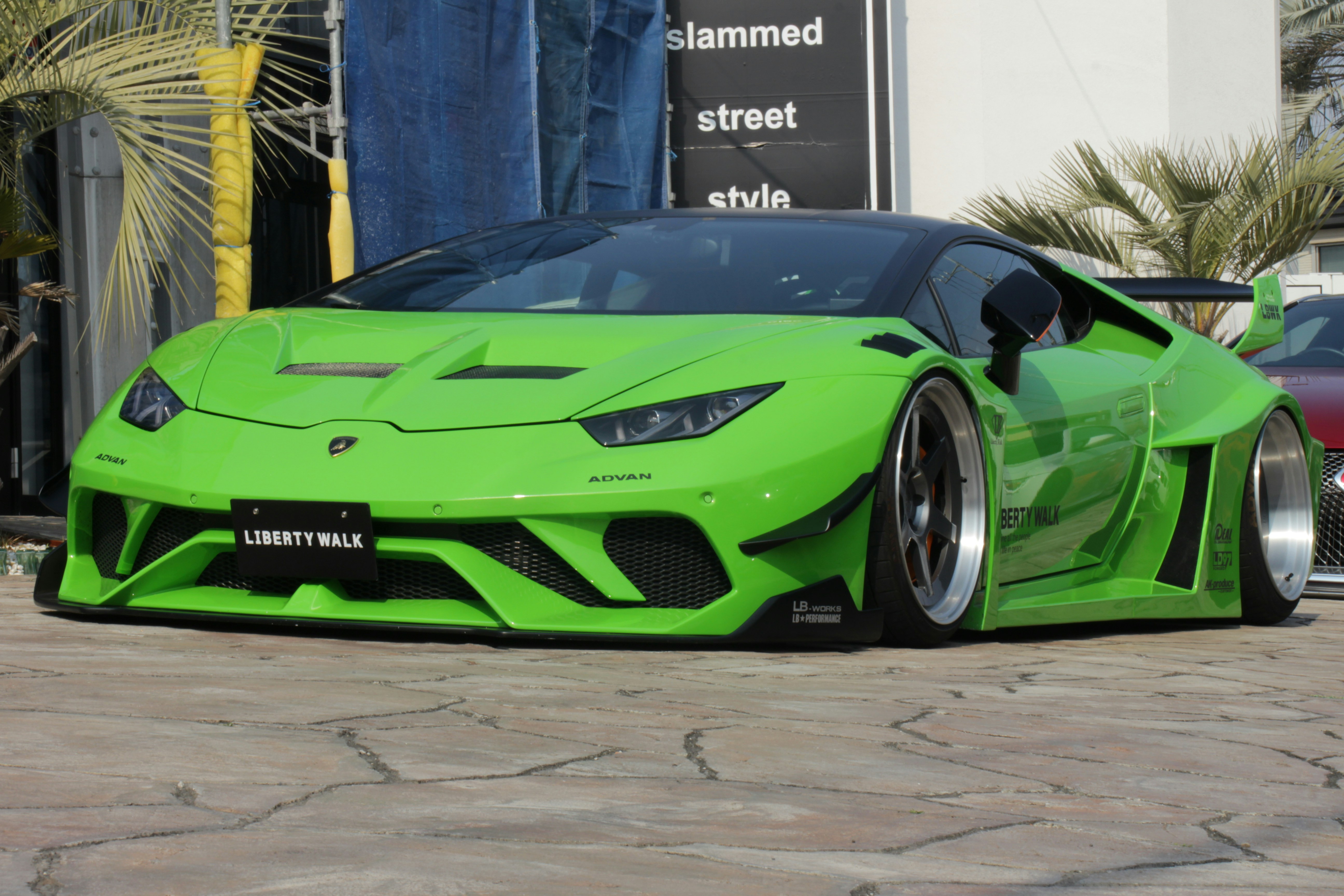 Lime Machine: A Neon-green Huracan Resting on Sunlit Pavement