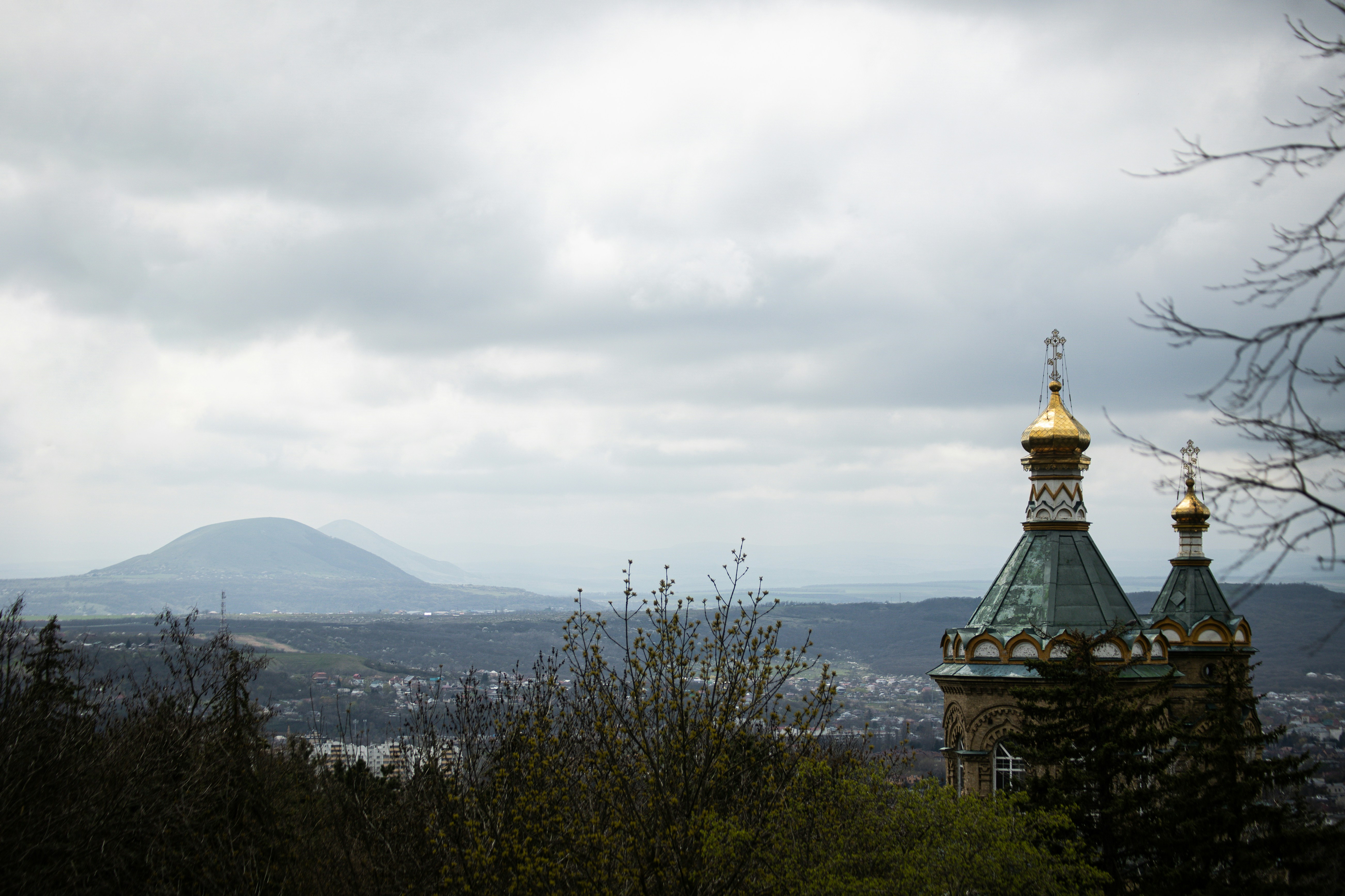Golden-topped towers over a distant skyline