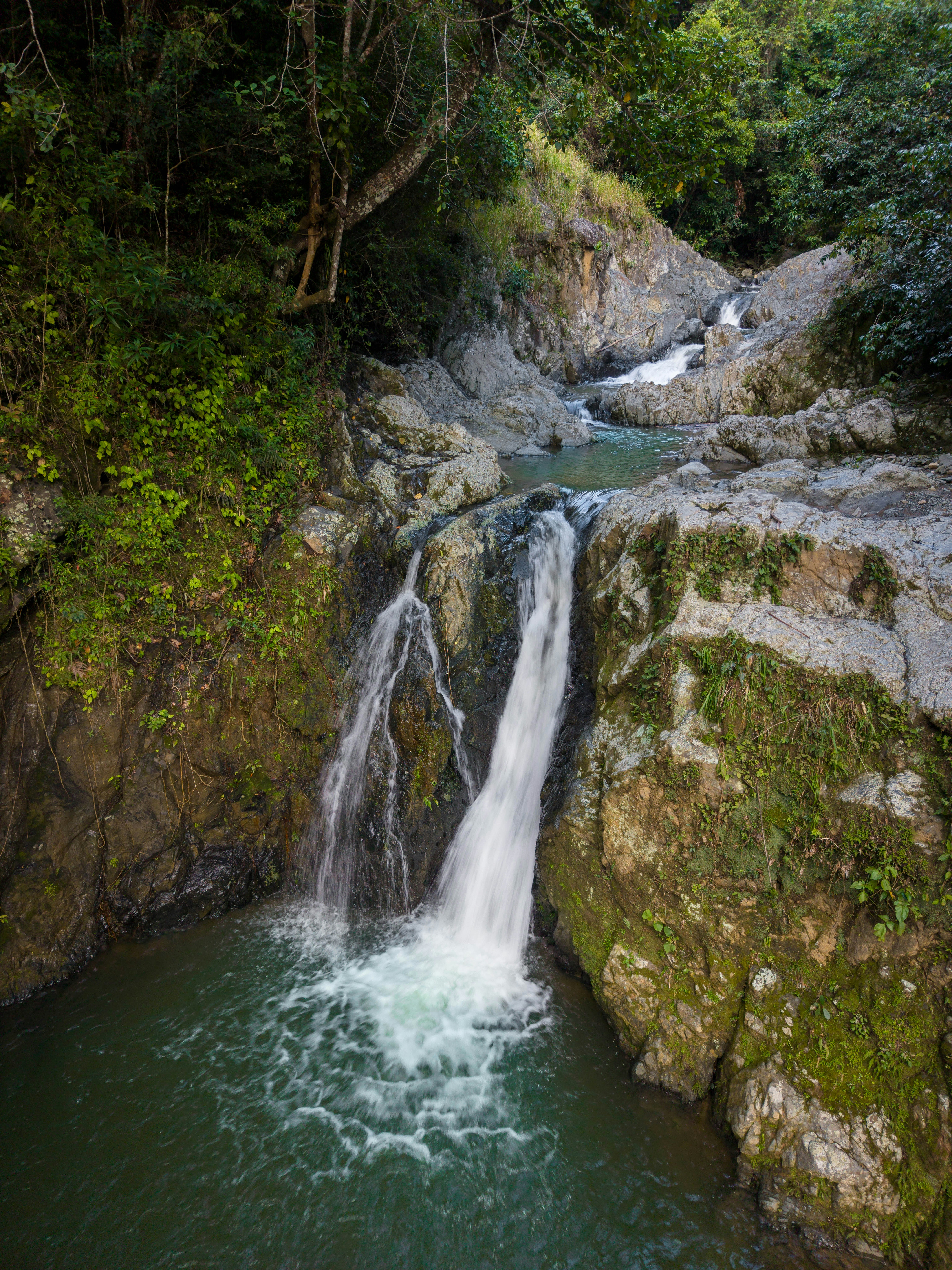 Whispering Falls: A River carve through mossy granite