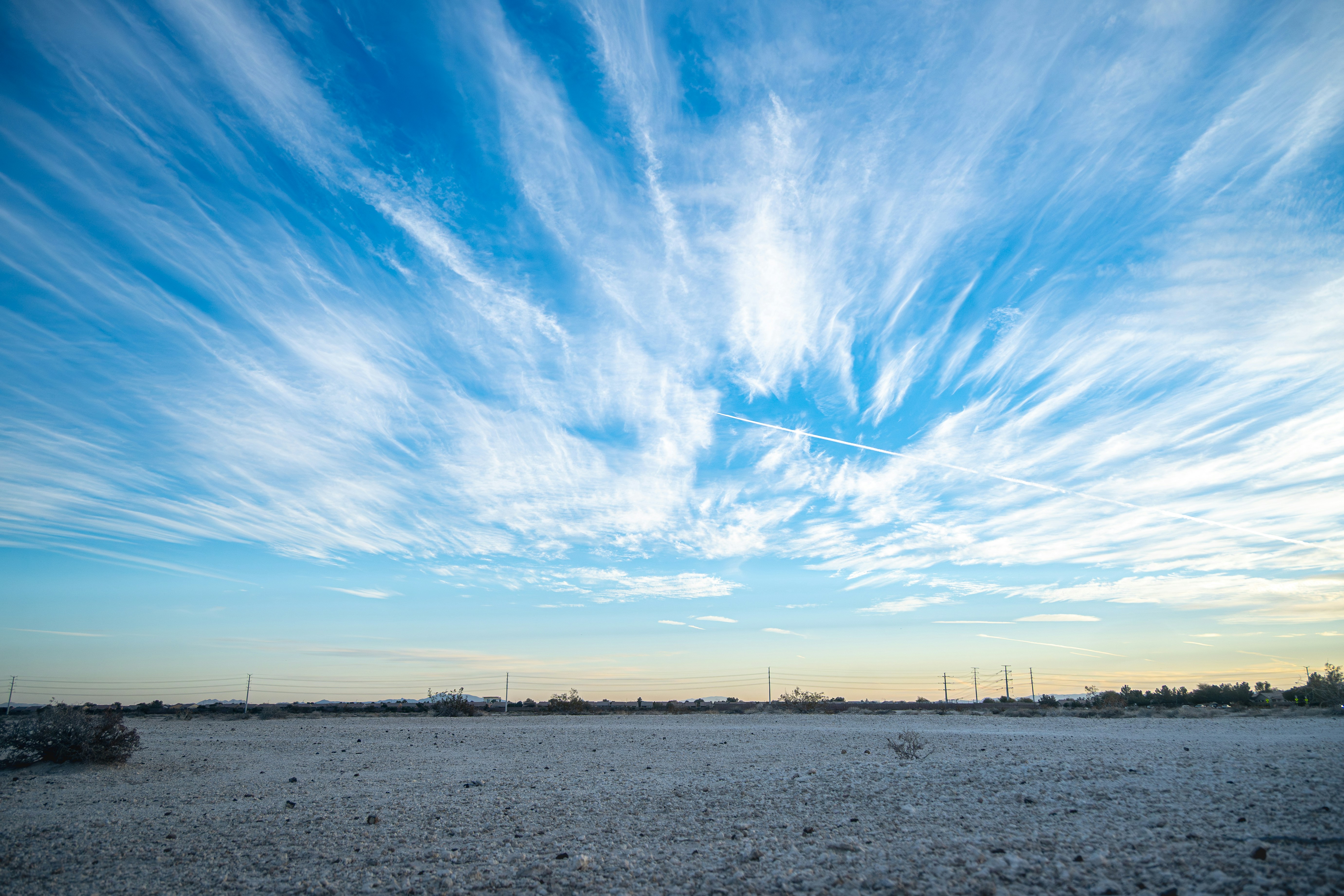 Low Horizon, Expansive Sky: Calm Desert Landscape at Dusk