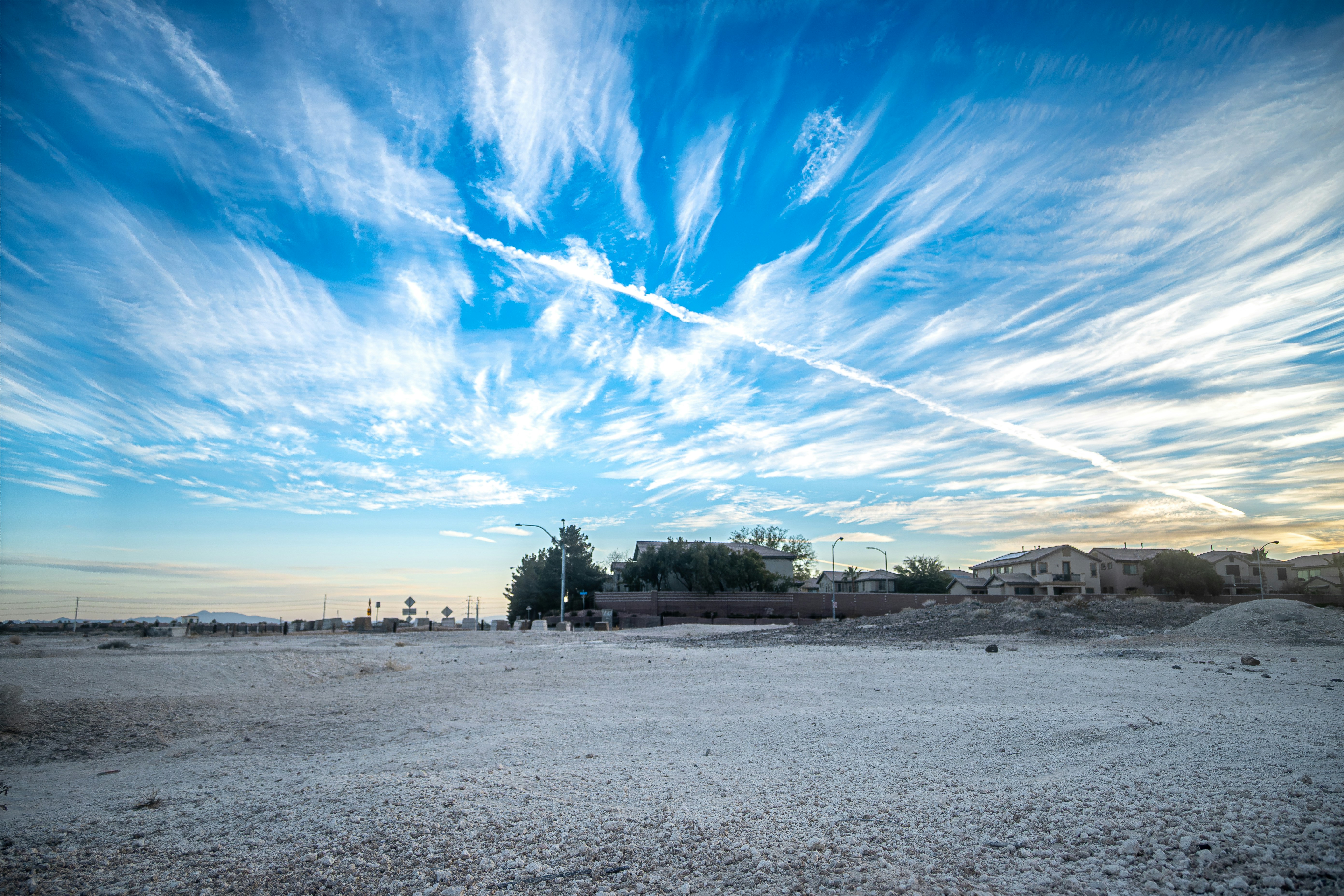 Low Tide at Distant Village Under Sky-Kissed Cloudscape