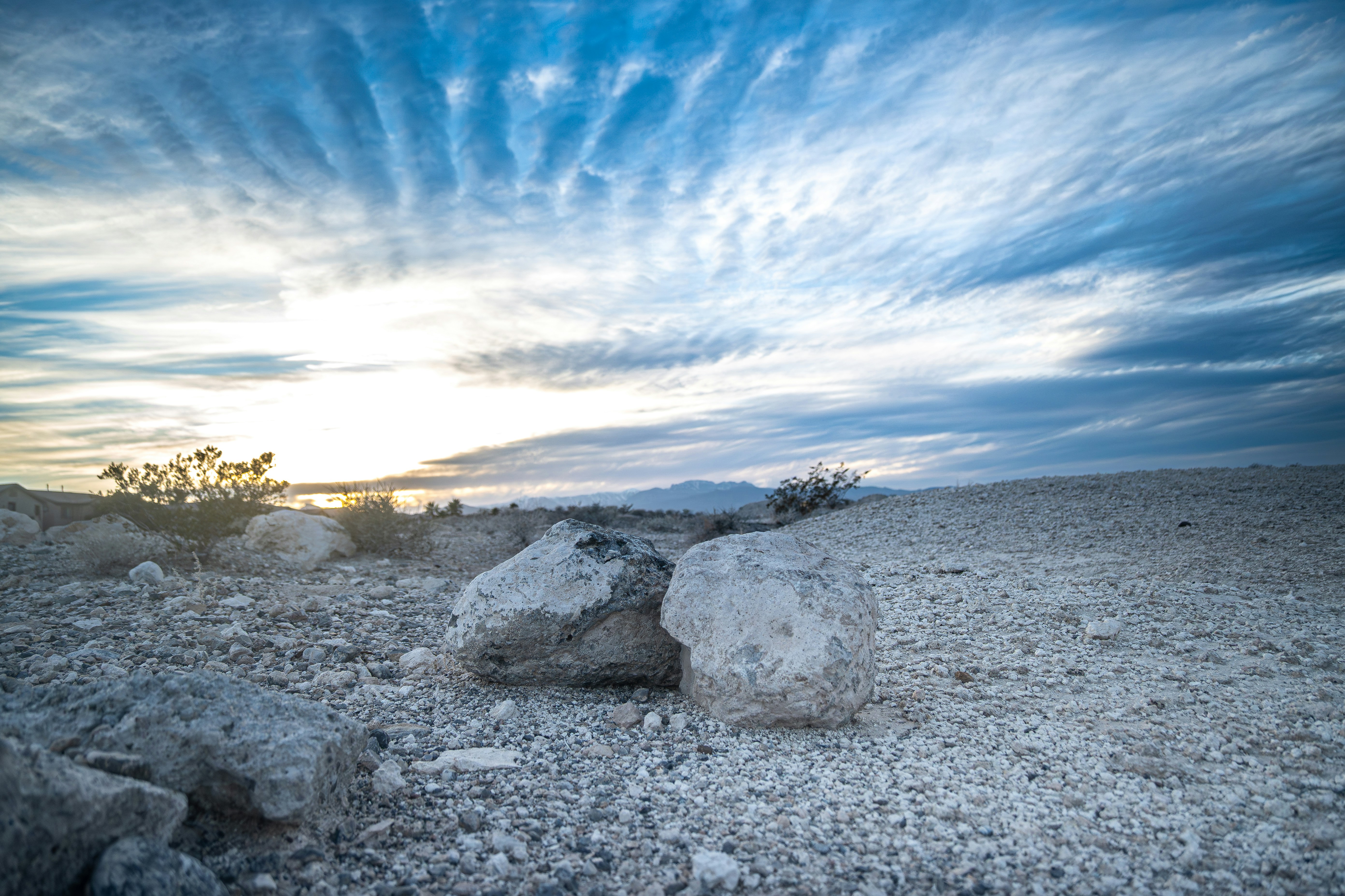 Low Horizon, Quiet Grit: Stones Beneath a Expansive Sky